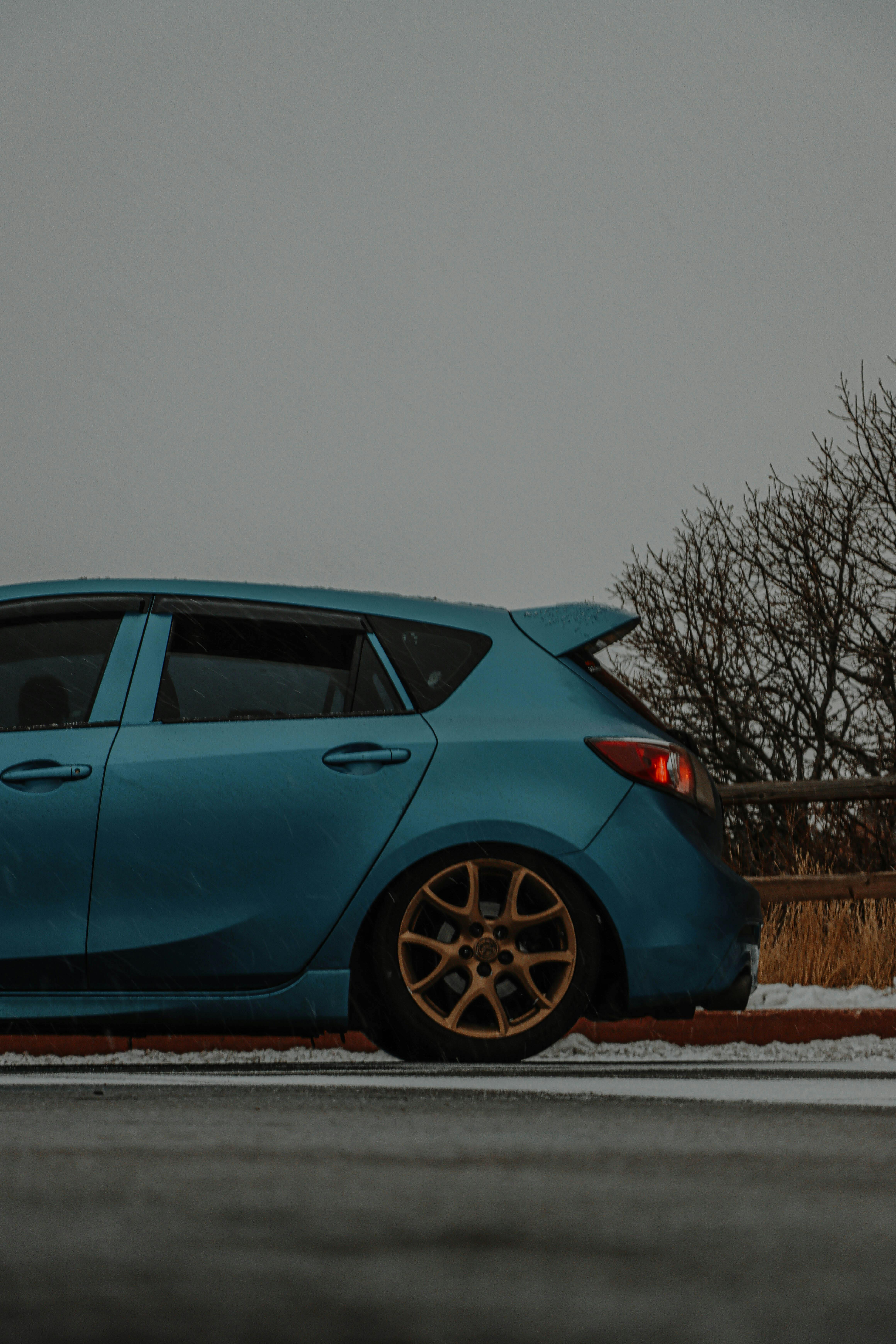 Blue Car with Gold Wheel · Free Stock Photo