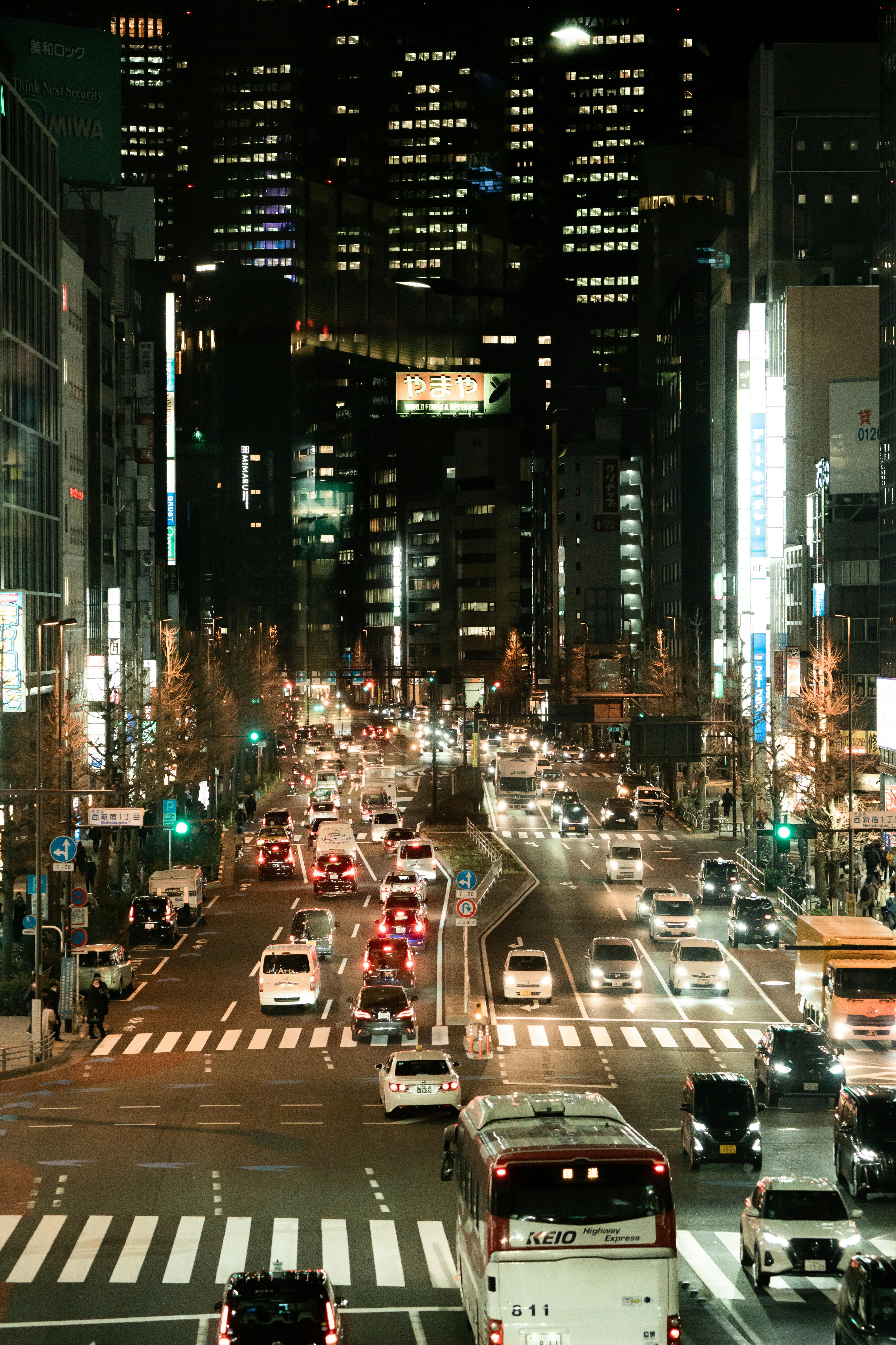 Cars on Road in City during Night Time · Free Stock Photo