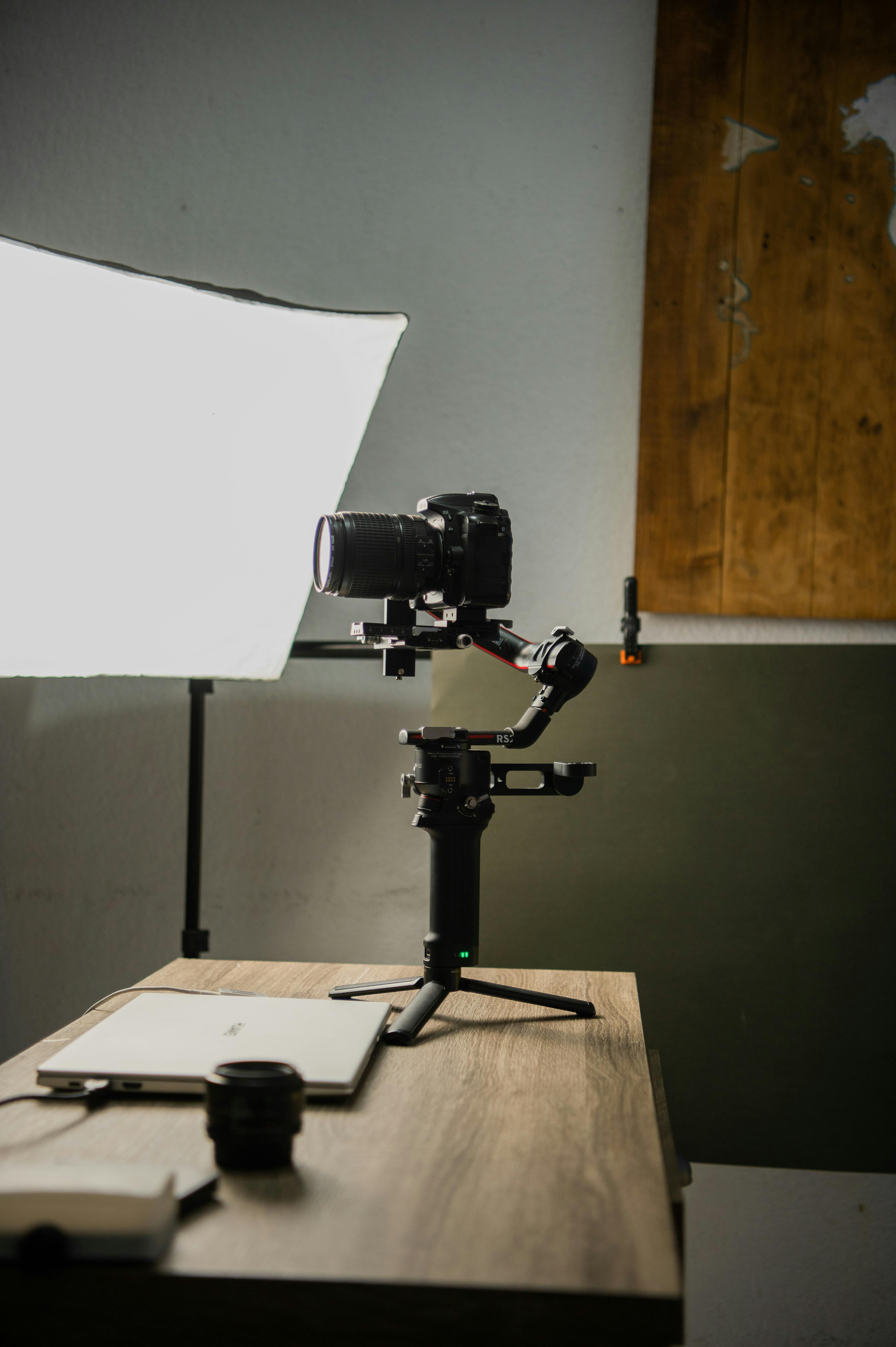 Camera on Tripod on Table · Free Stock Photo