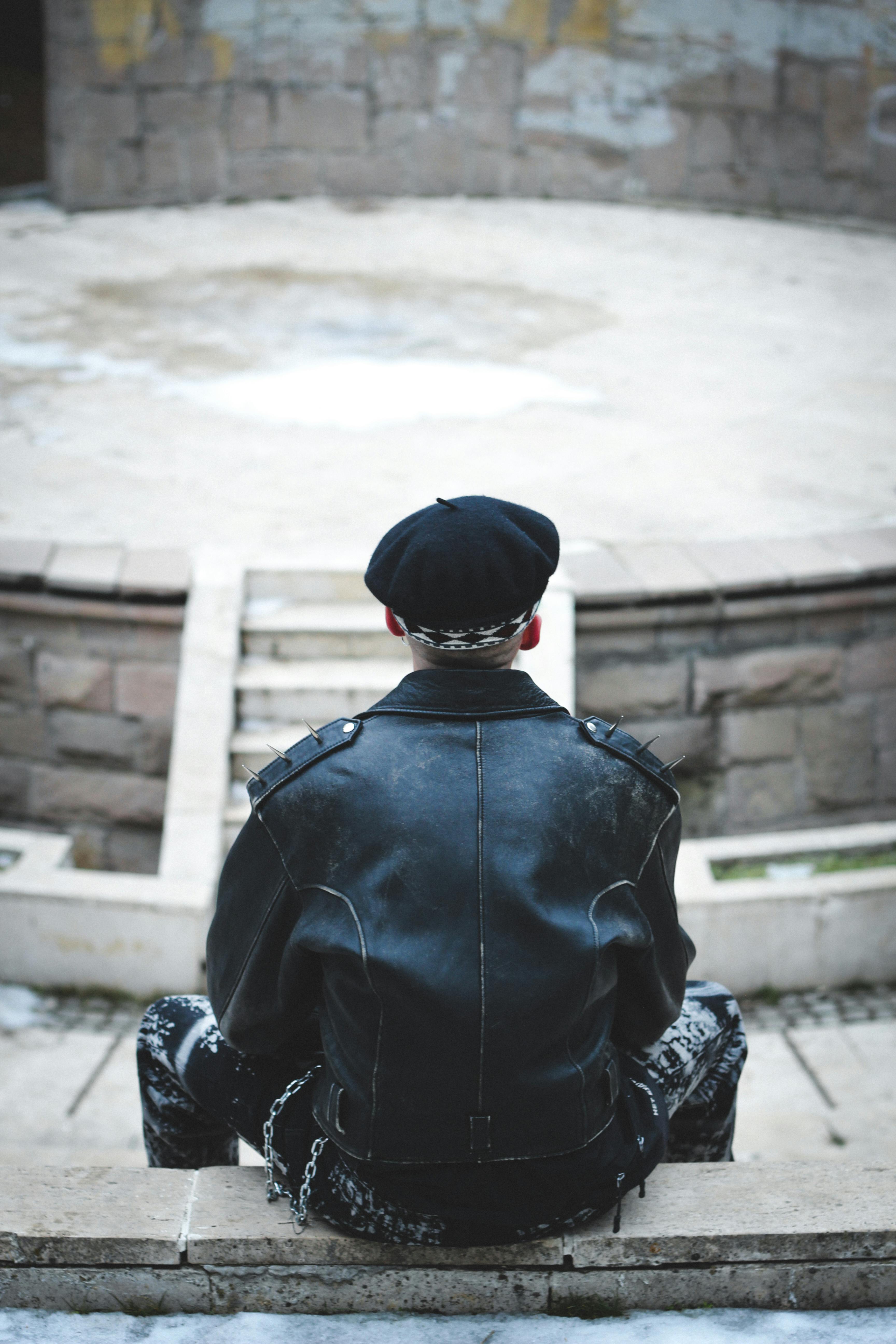 Back View of a Man with a Beret Sitting · Free Stock Photo