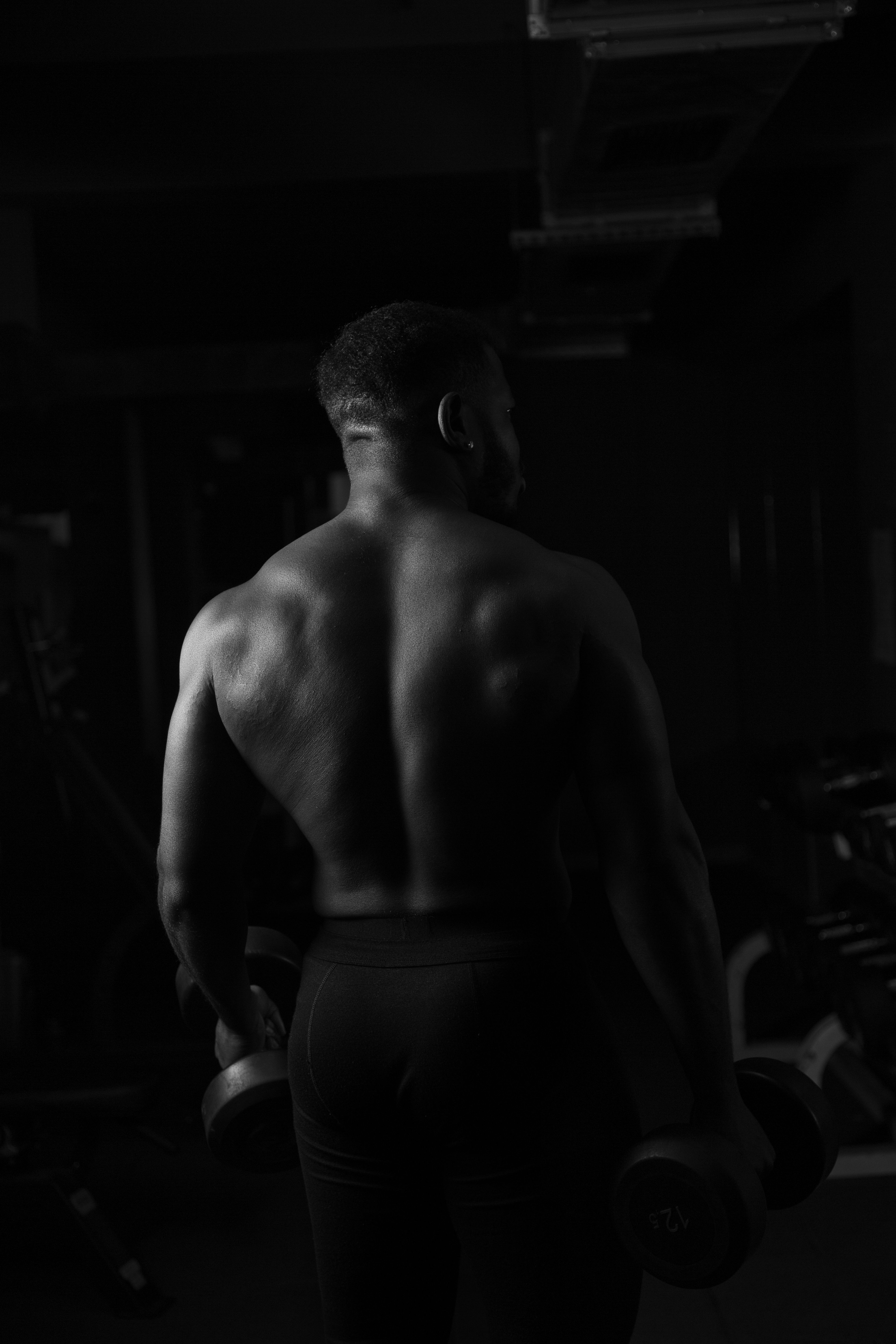 Back View of a Man Flexing his Muscle · Free Stock Photo