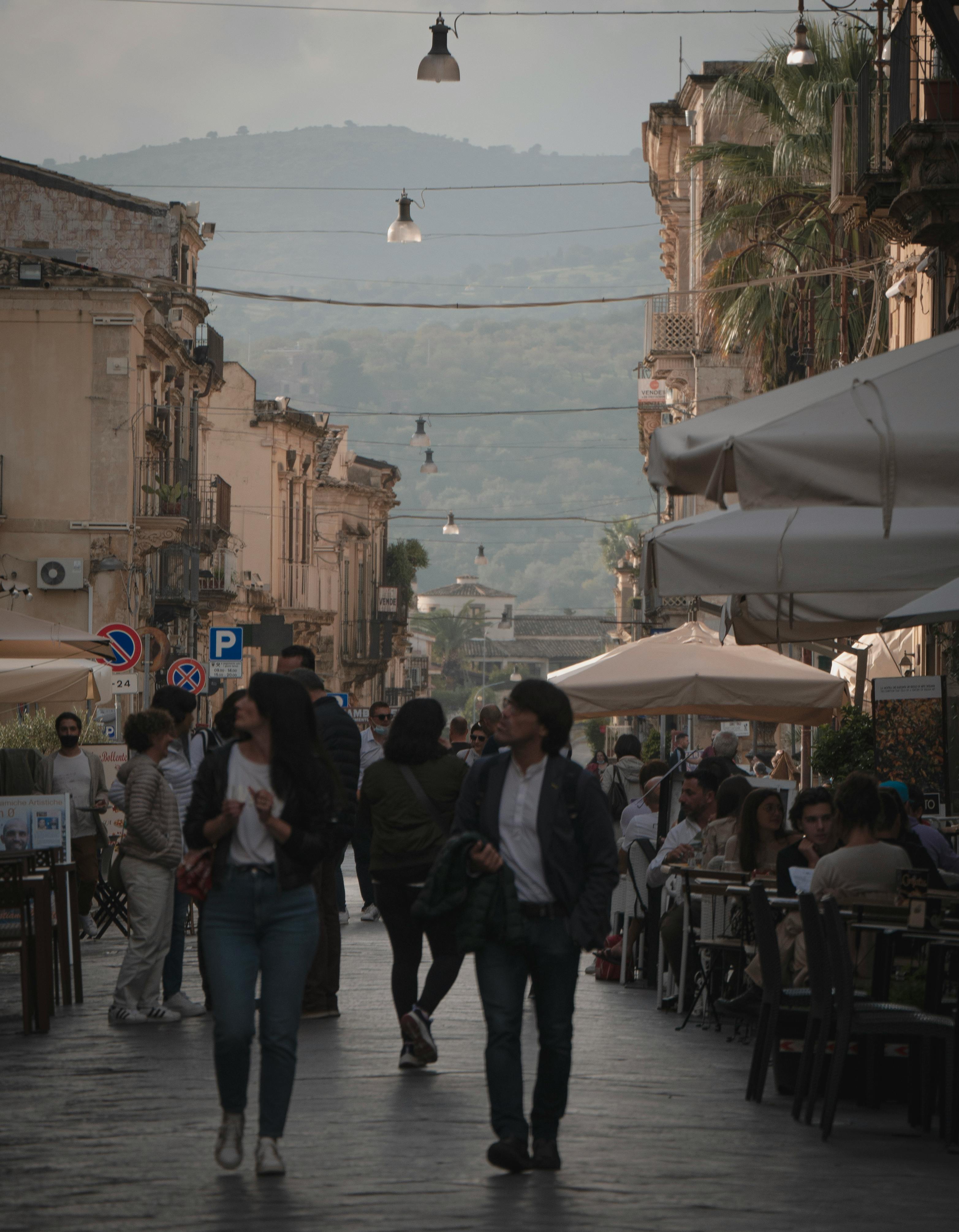 Photo of People Walking on a Street · Free Stock Photo