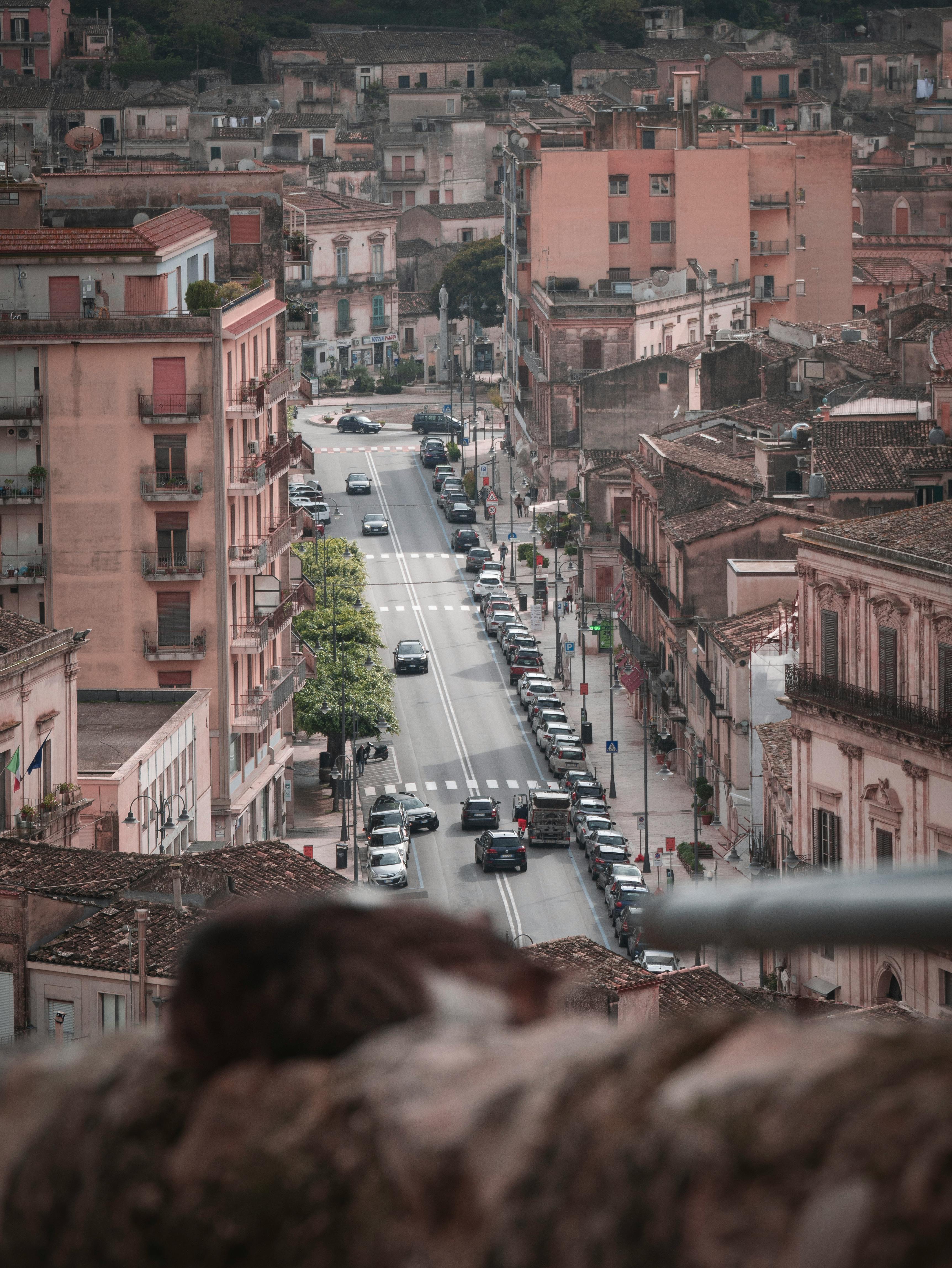 Photo of Cars Between Buildings · Free Stock Photo
