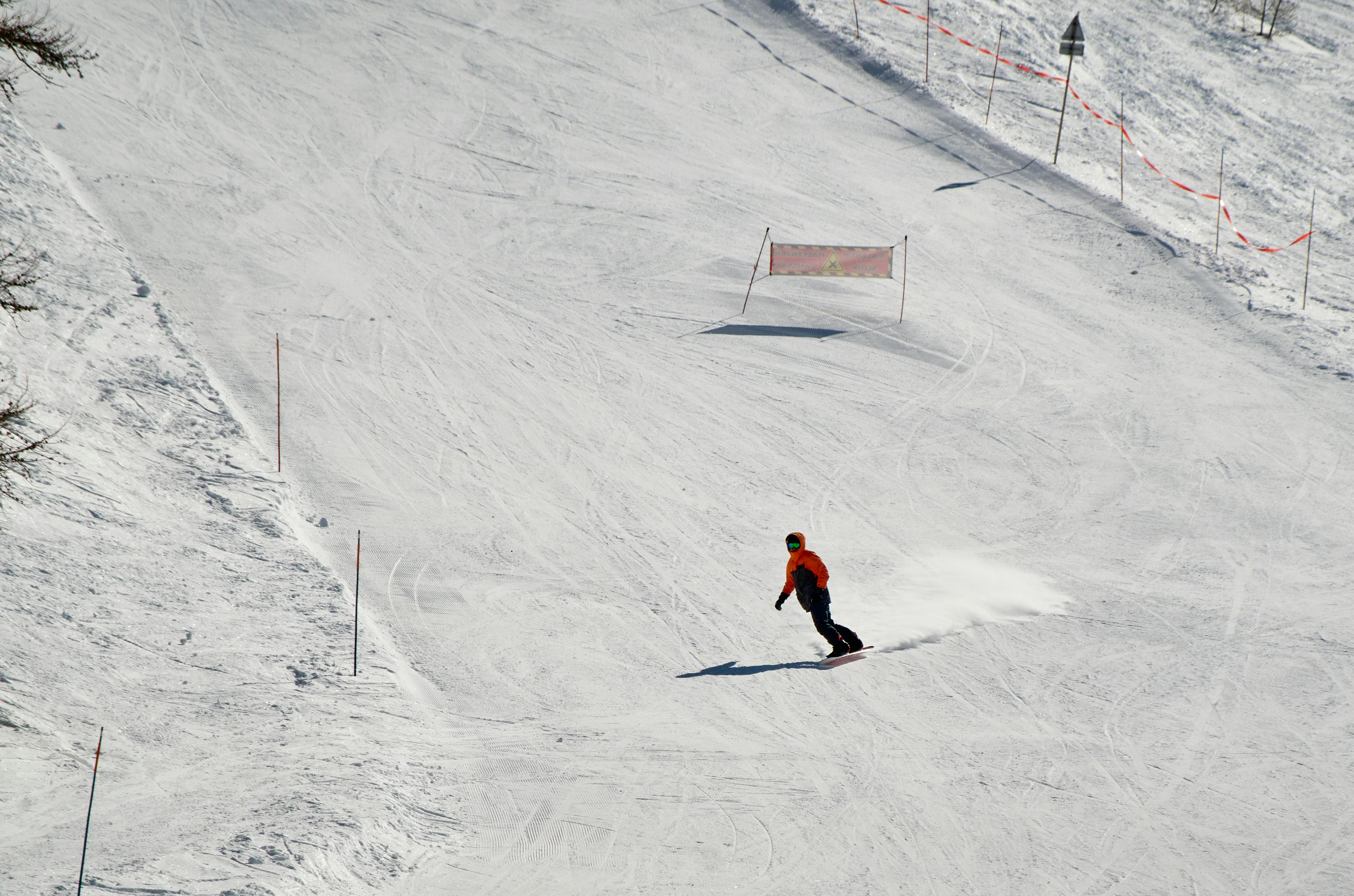 Woman in Yellow Jacket Standing Beside her Pink Snowboard · Free Stock ...
