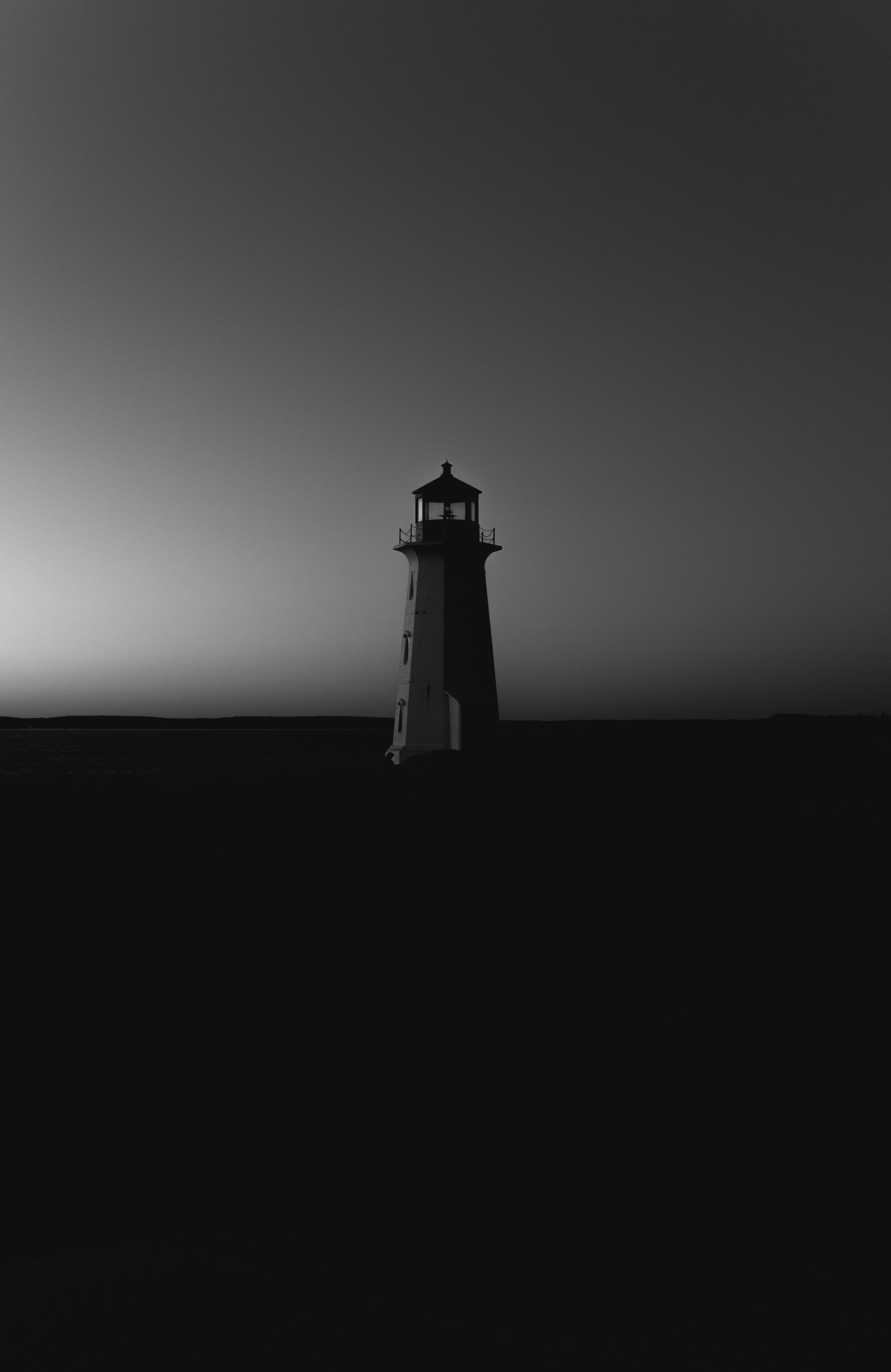 Grayscale Photo of a Lighthouse · Free Stock Photo