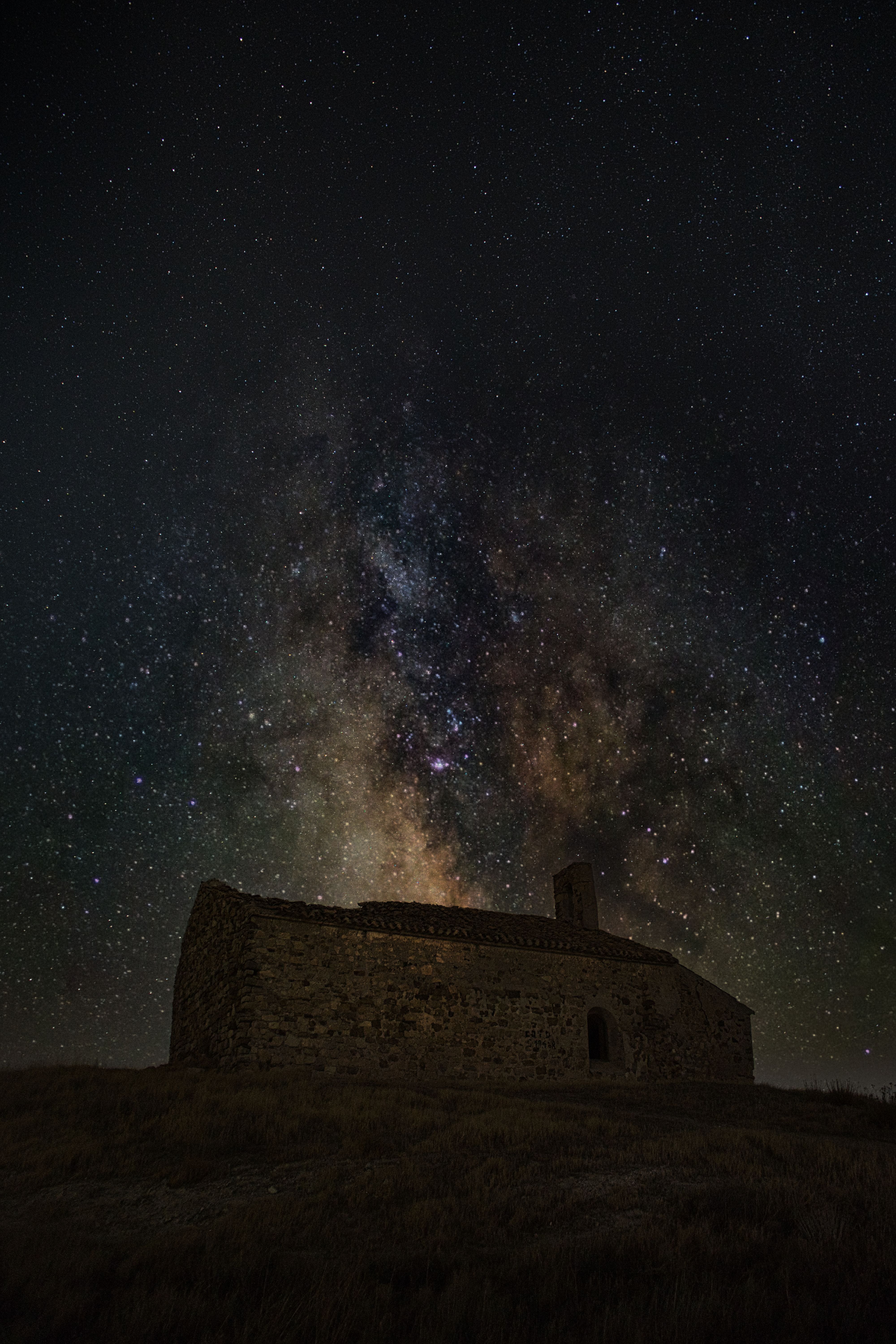 Night Sky over Building in Countryside · Free Stock Photo