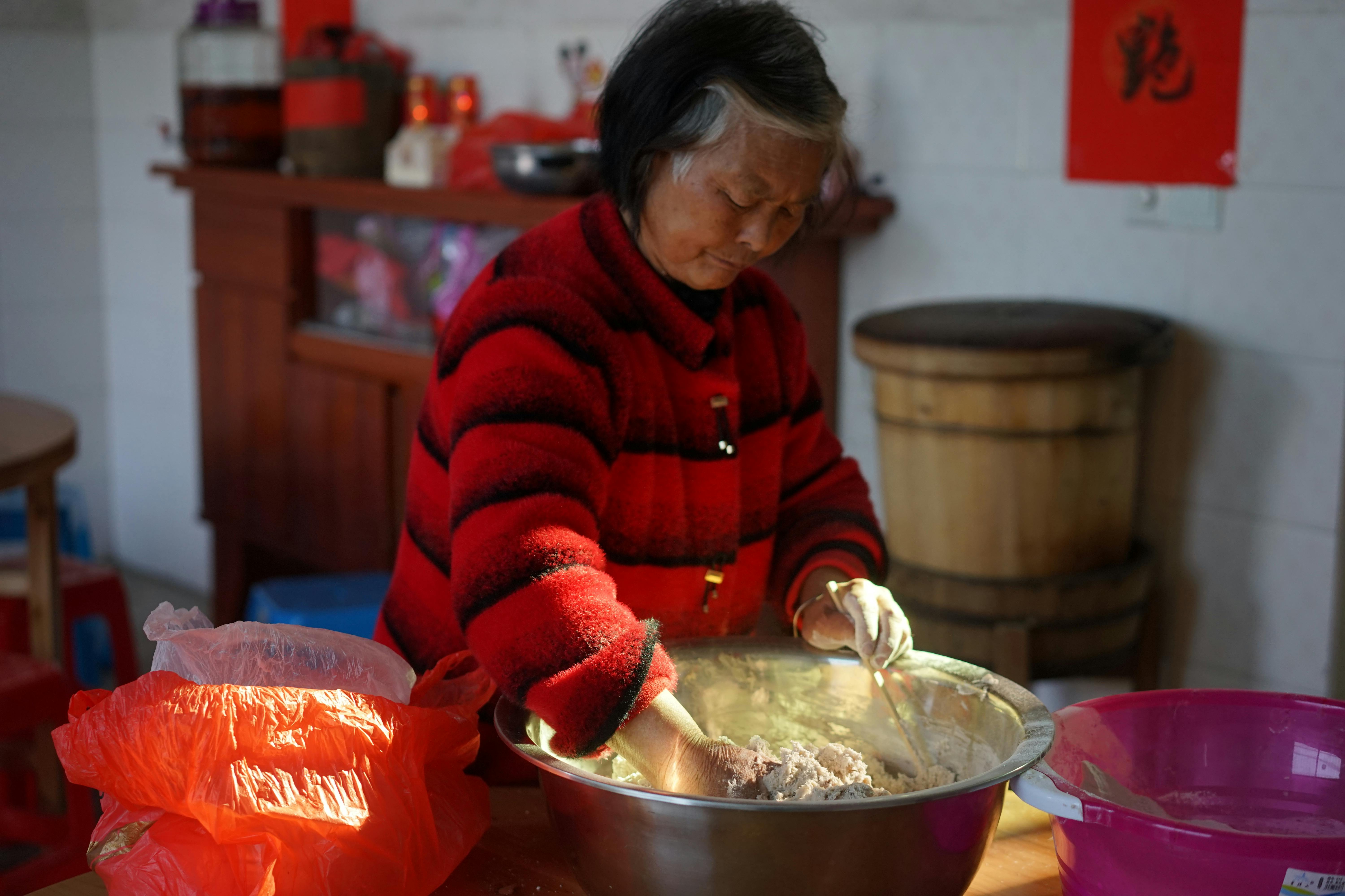 Person Using Brown Wooden Rolling Pin · Free Stock Photo