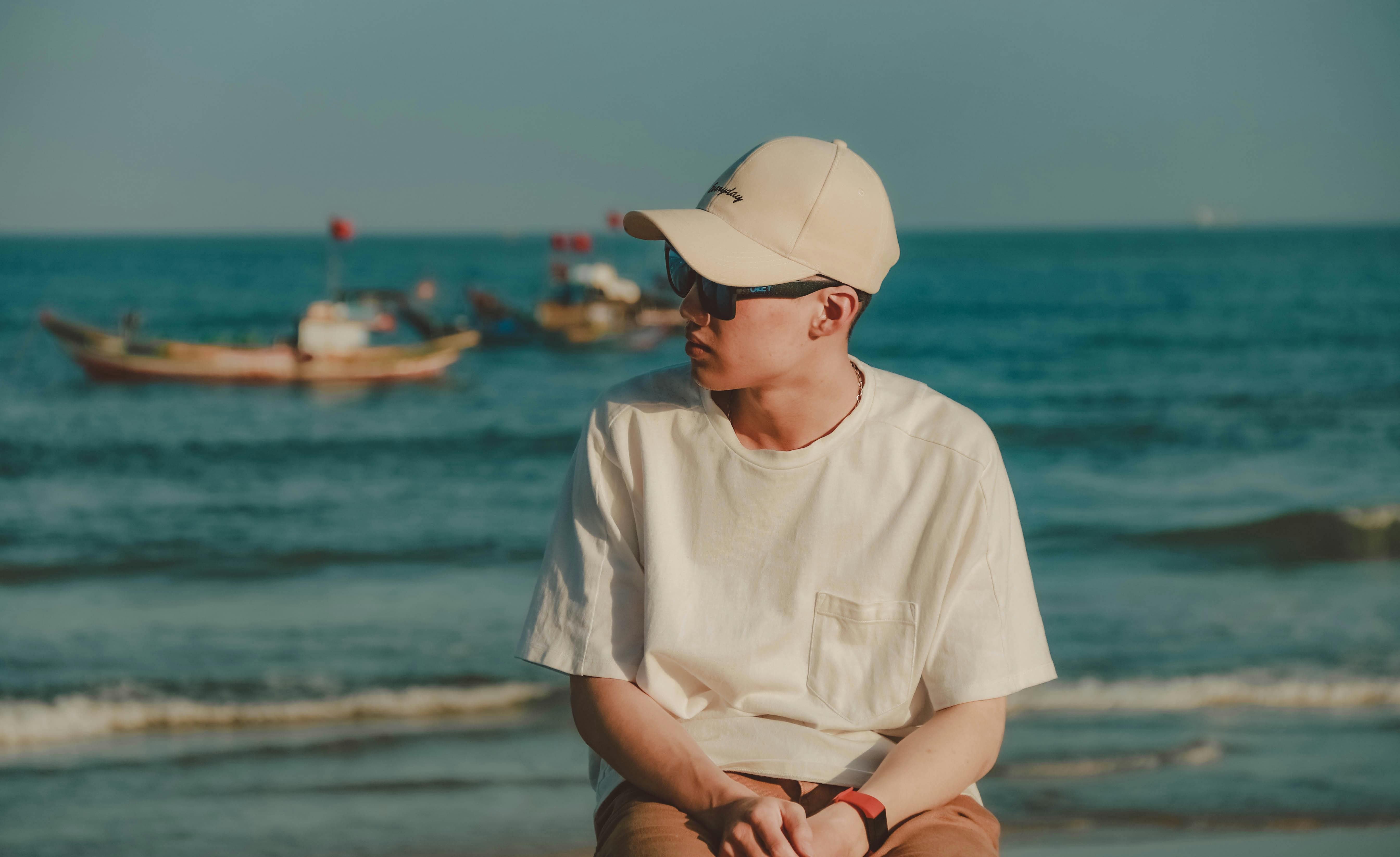 Photo of Man Wearing Cap Looking Sideways · Free Stock Photo