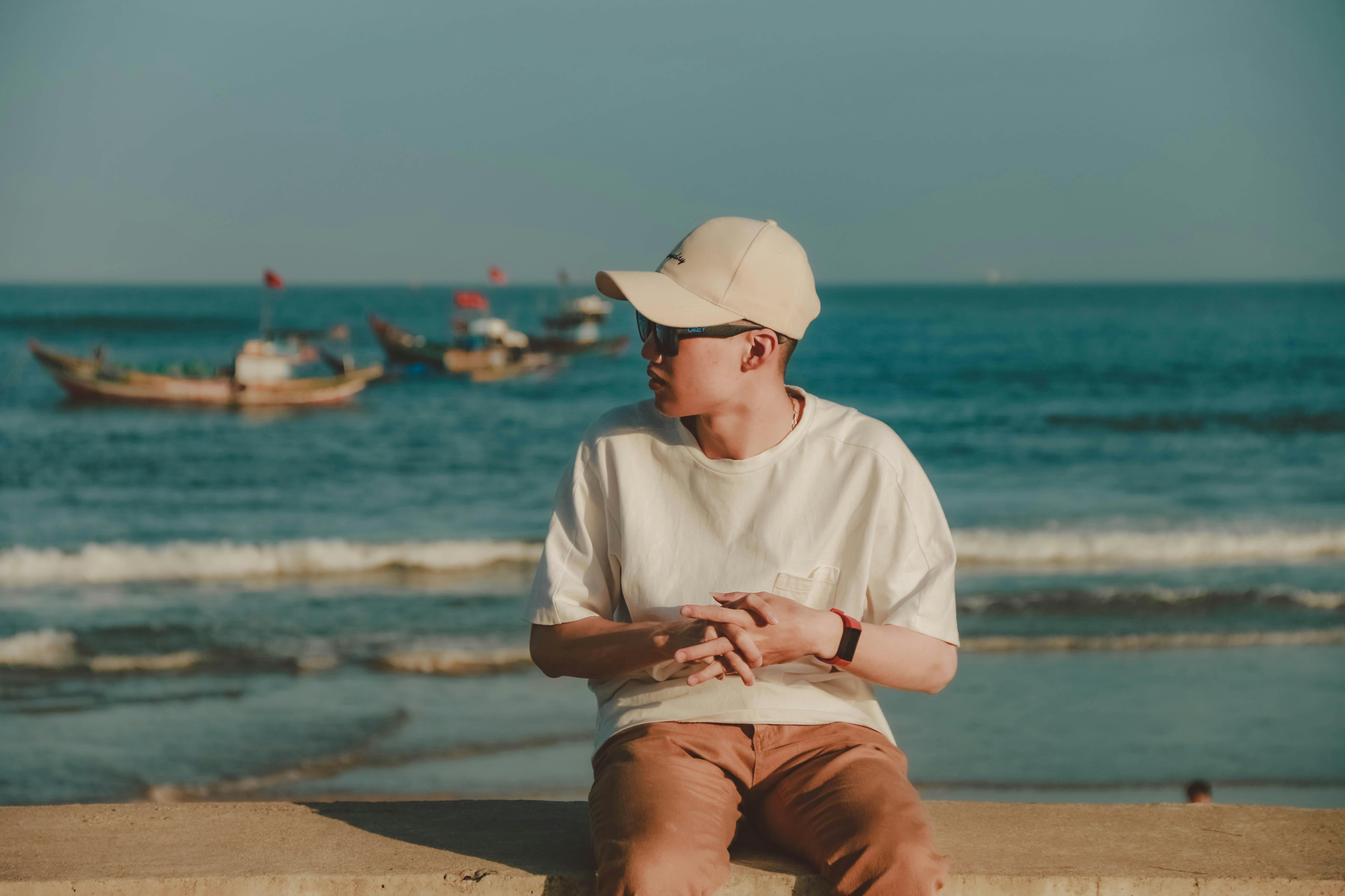 Photo of Man Wearing Cap Looking Sideways · Free Stock Photo