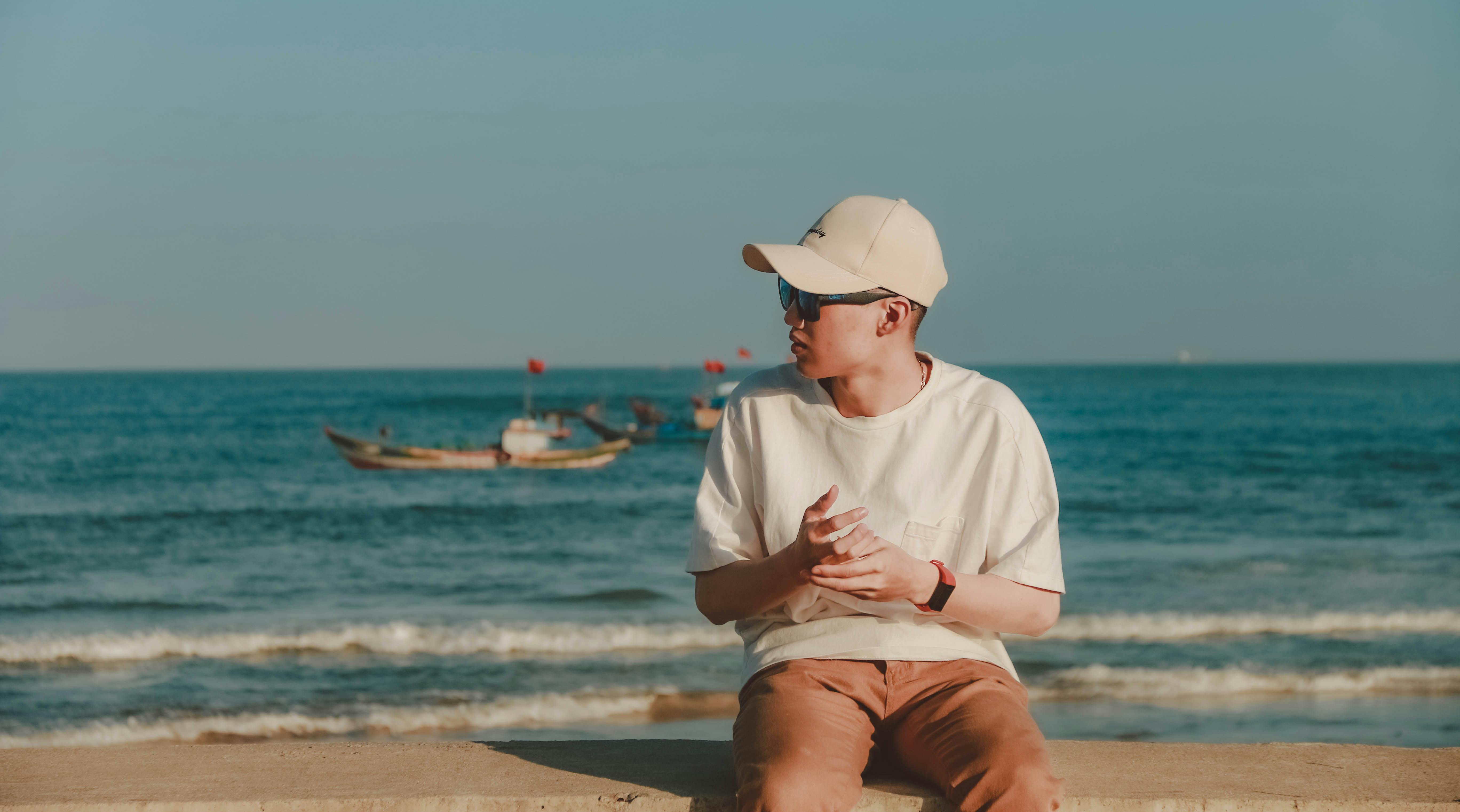 Photo of Man Wearing Cap Looking Sideways · Free Stock Photo