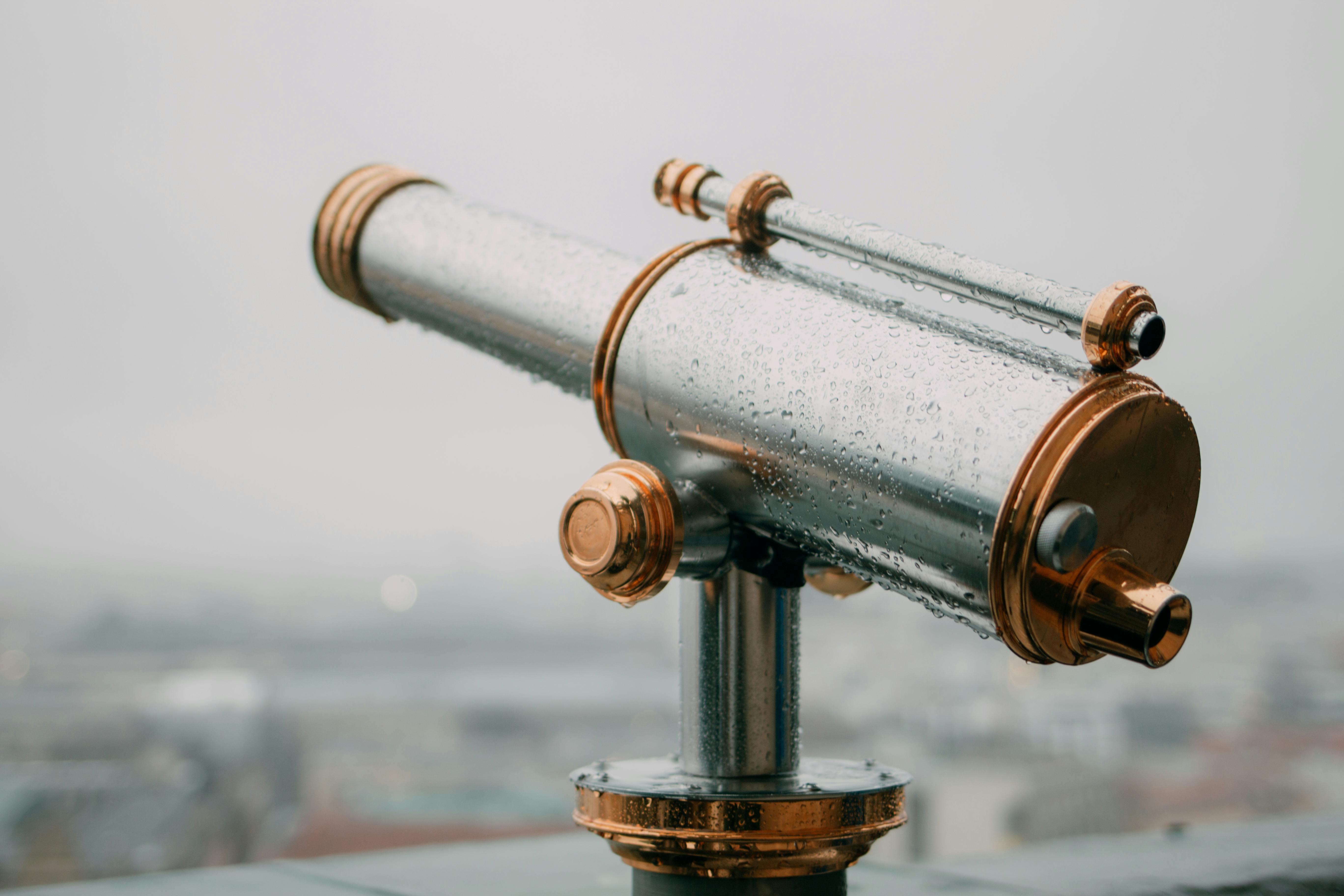 Close-Up Shot of a Silver and Gold Telescope · Free Stock Photo