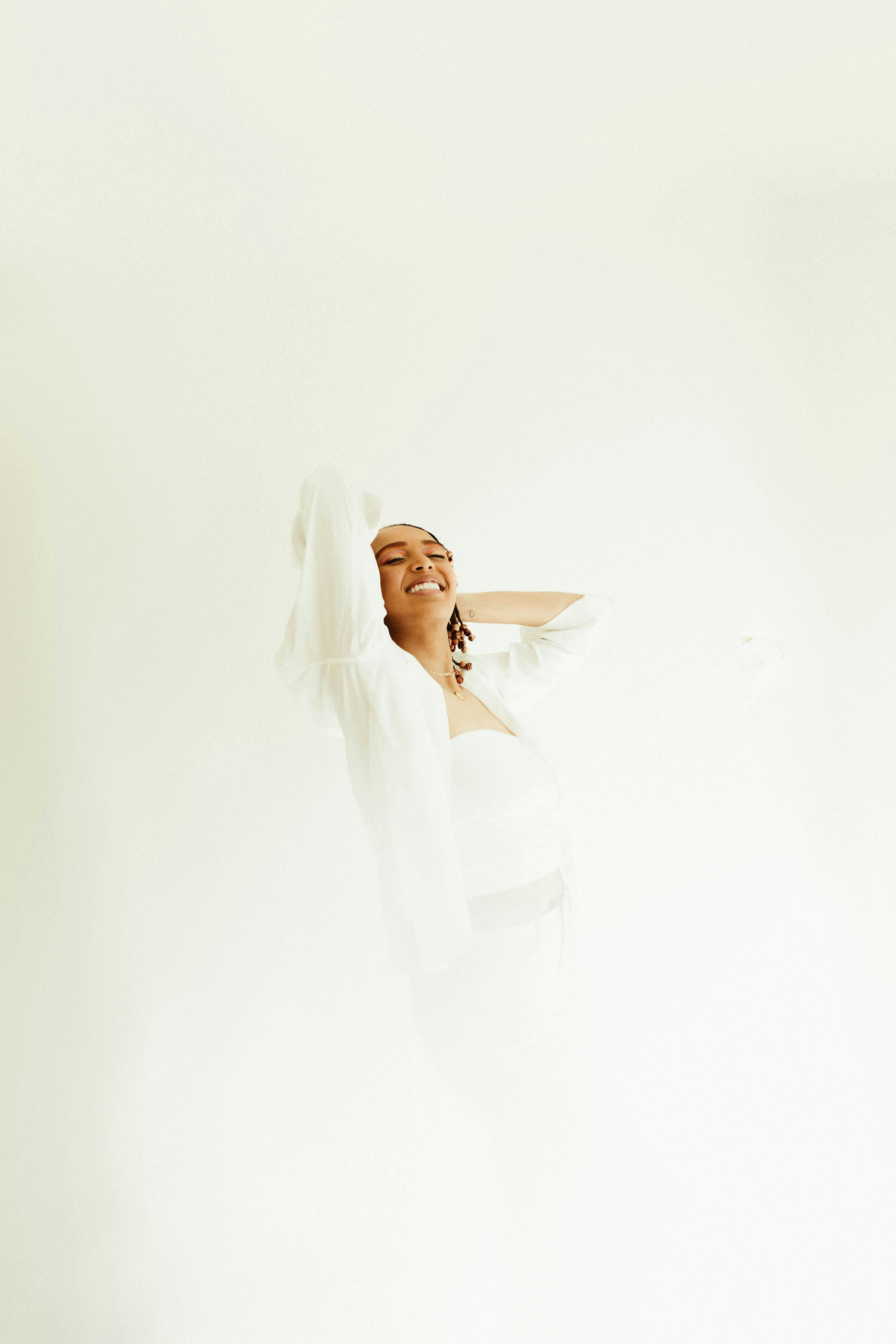 Woman in White Top Posing · Free Stock Photo