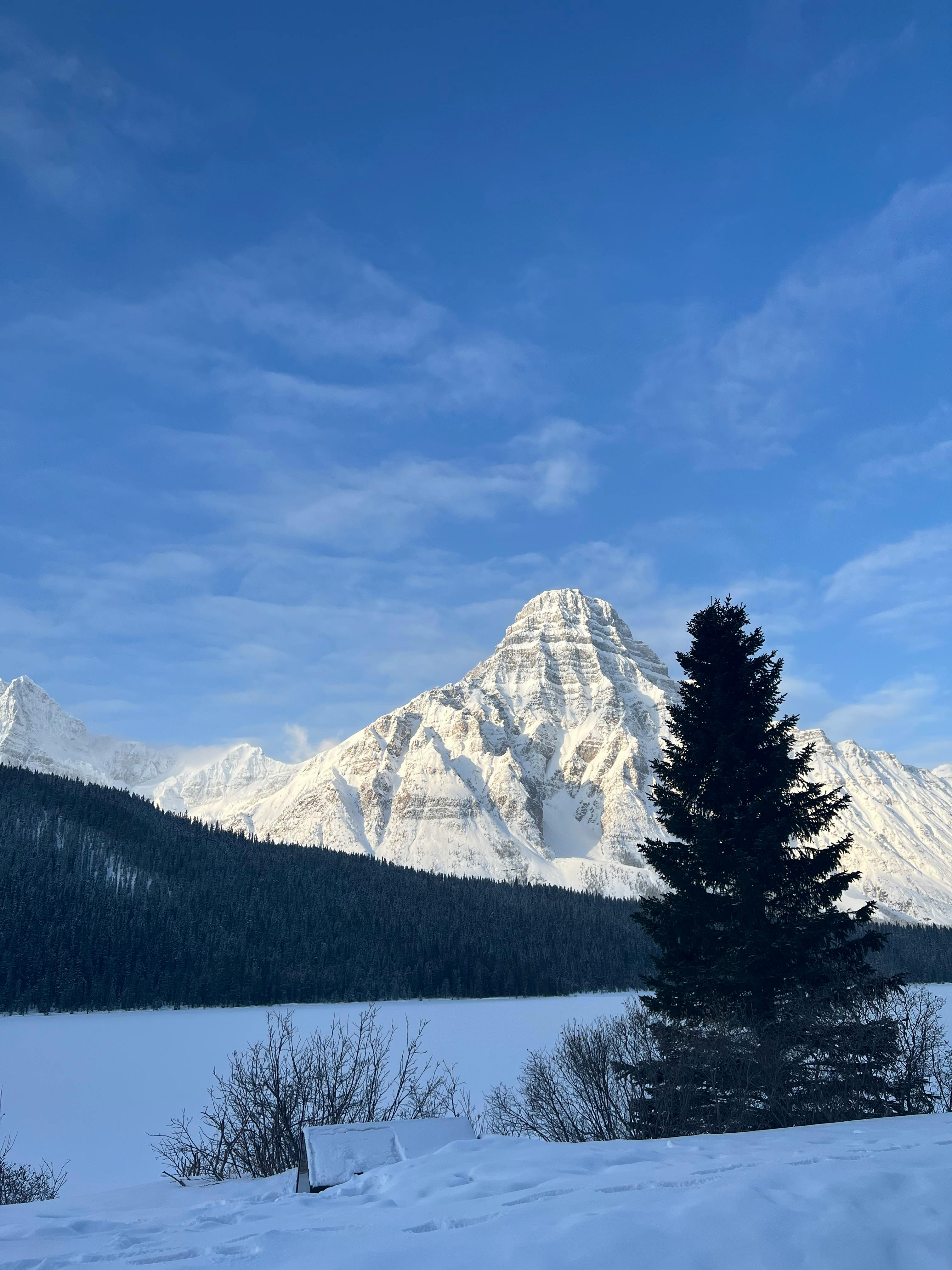Moon Rising Behind the Snow Capped Mountain · Free Stock Photo