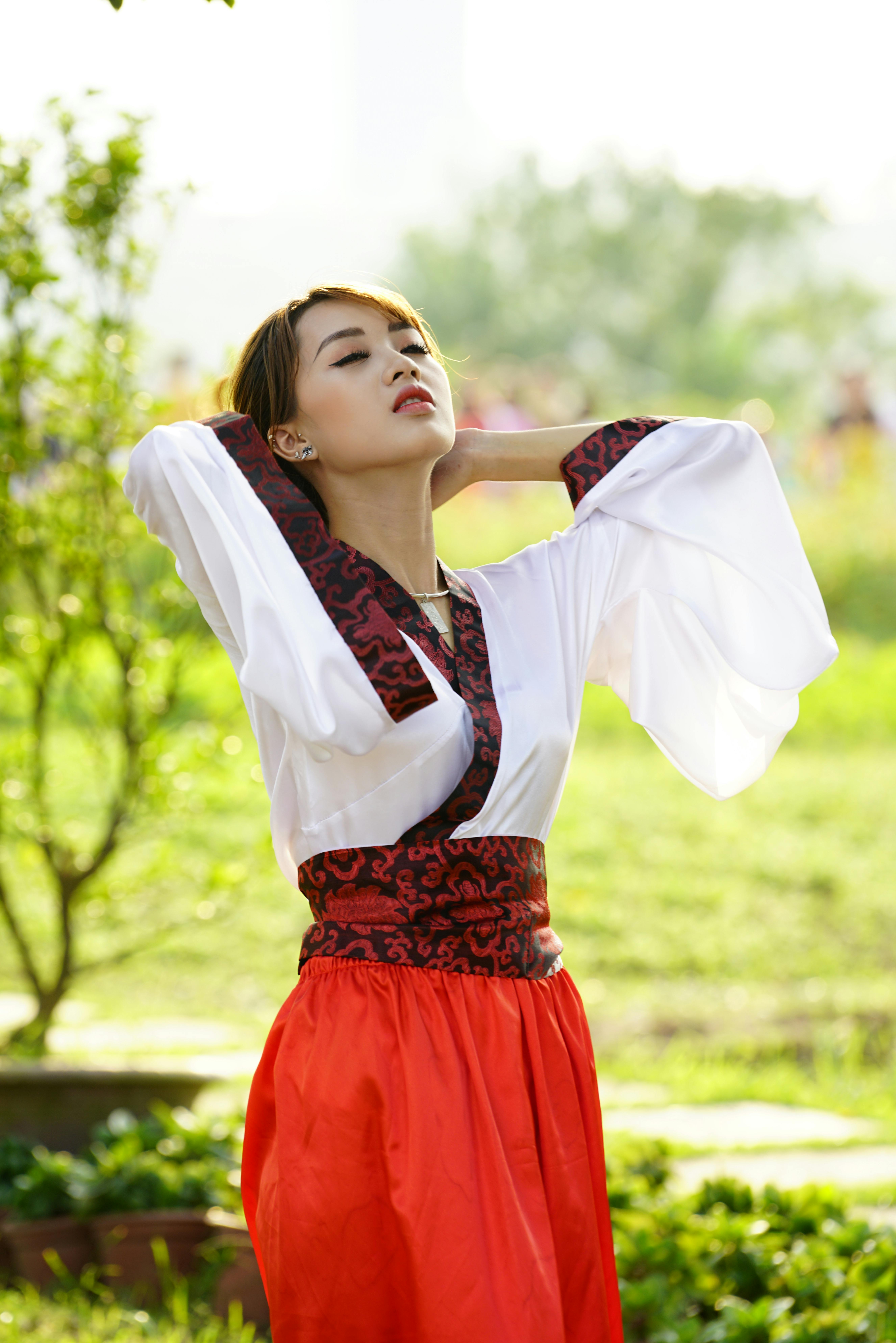 A Woman Wearing Hanfu Gown Standing Near Cherry Blossom Tree · Free ...