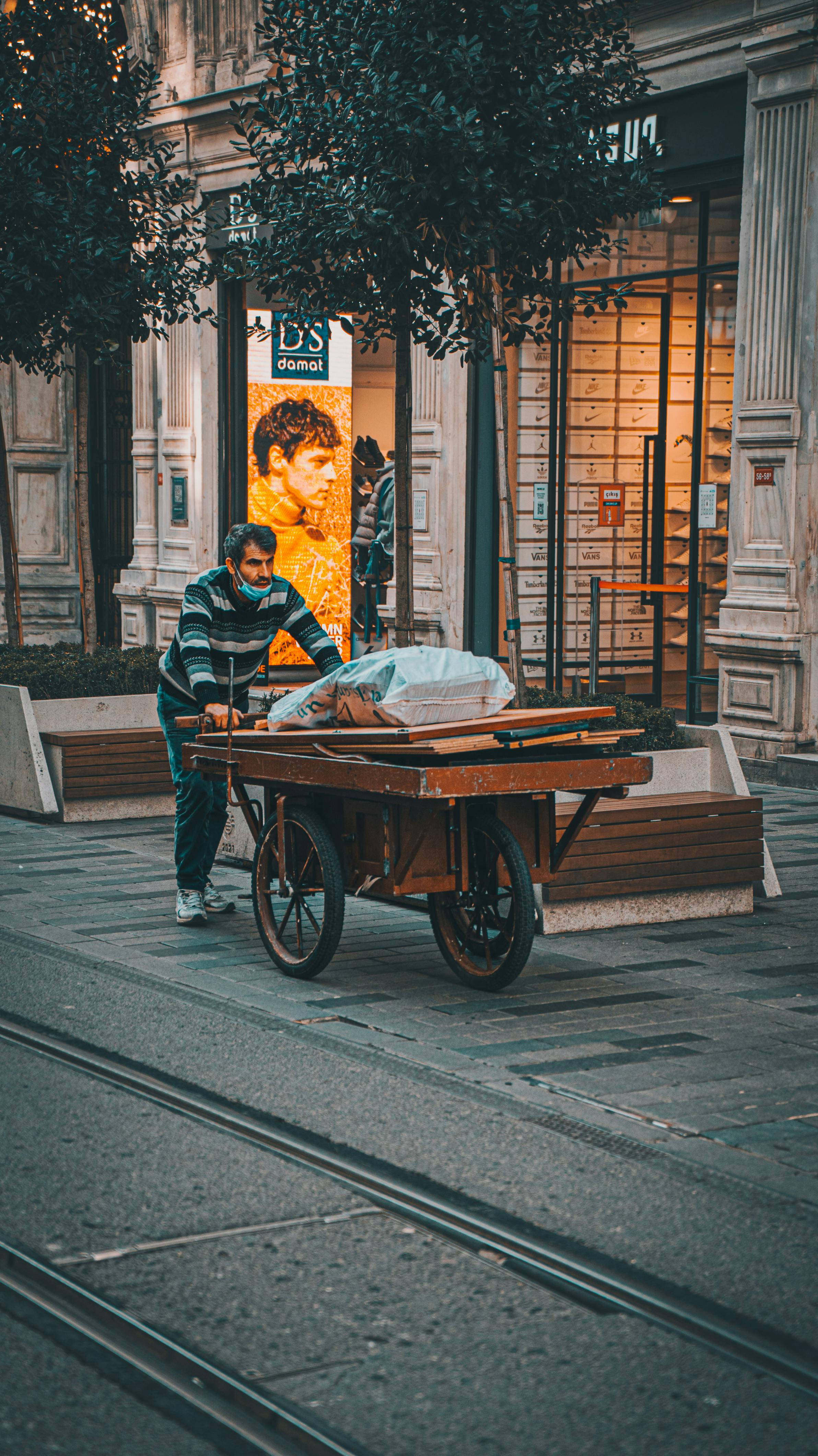 A Homeless Man Pushing Shopping Cart · Free Stock Photo