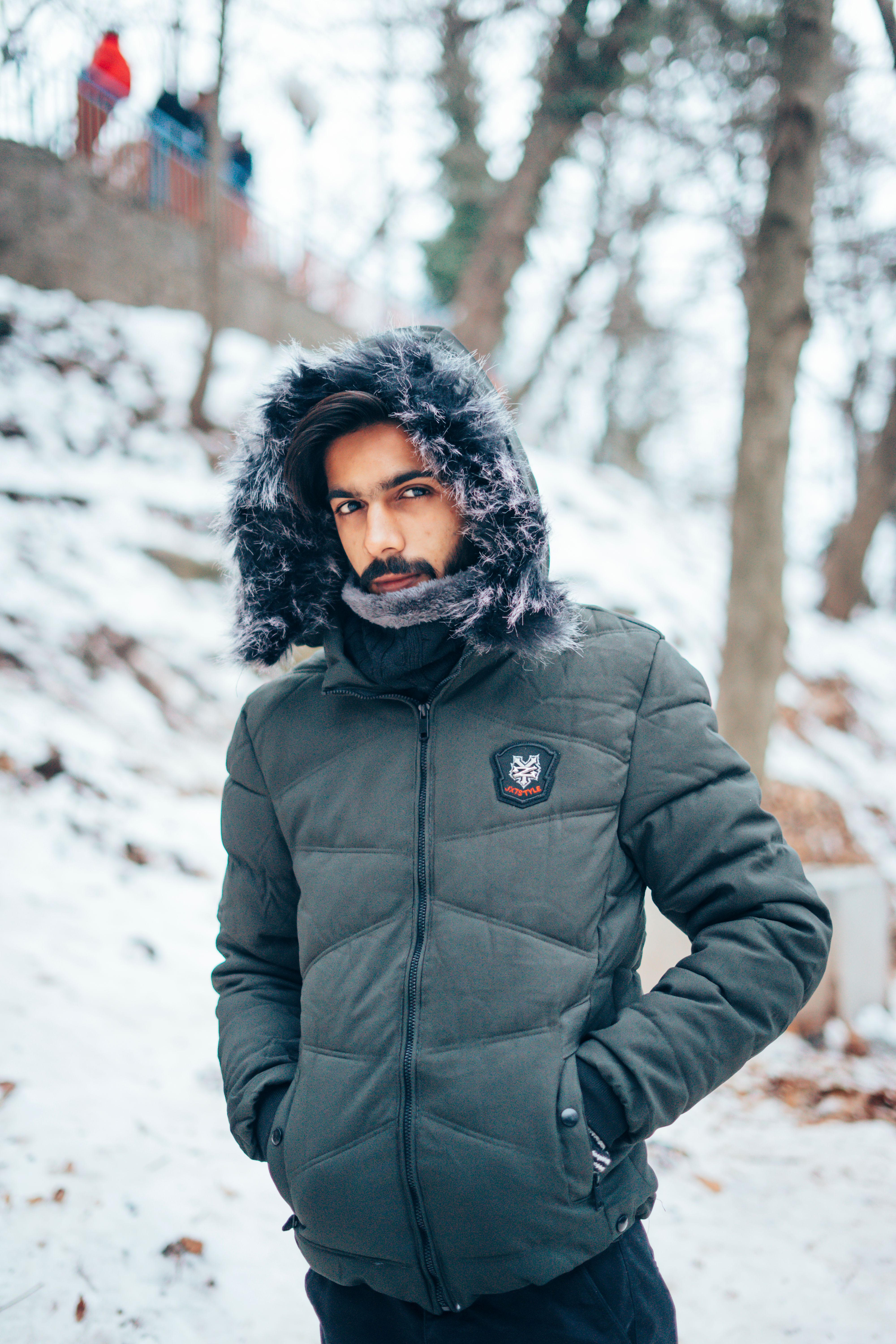 Close-Up View of Man Zipping Jacket · Free Stock Photo