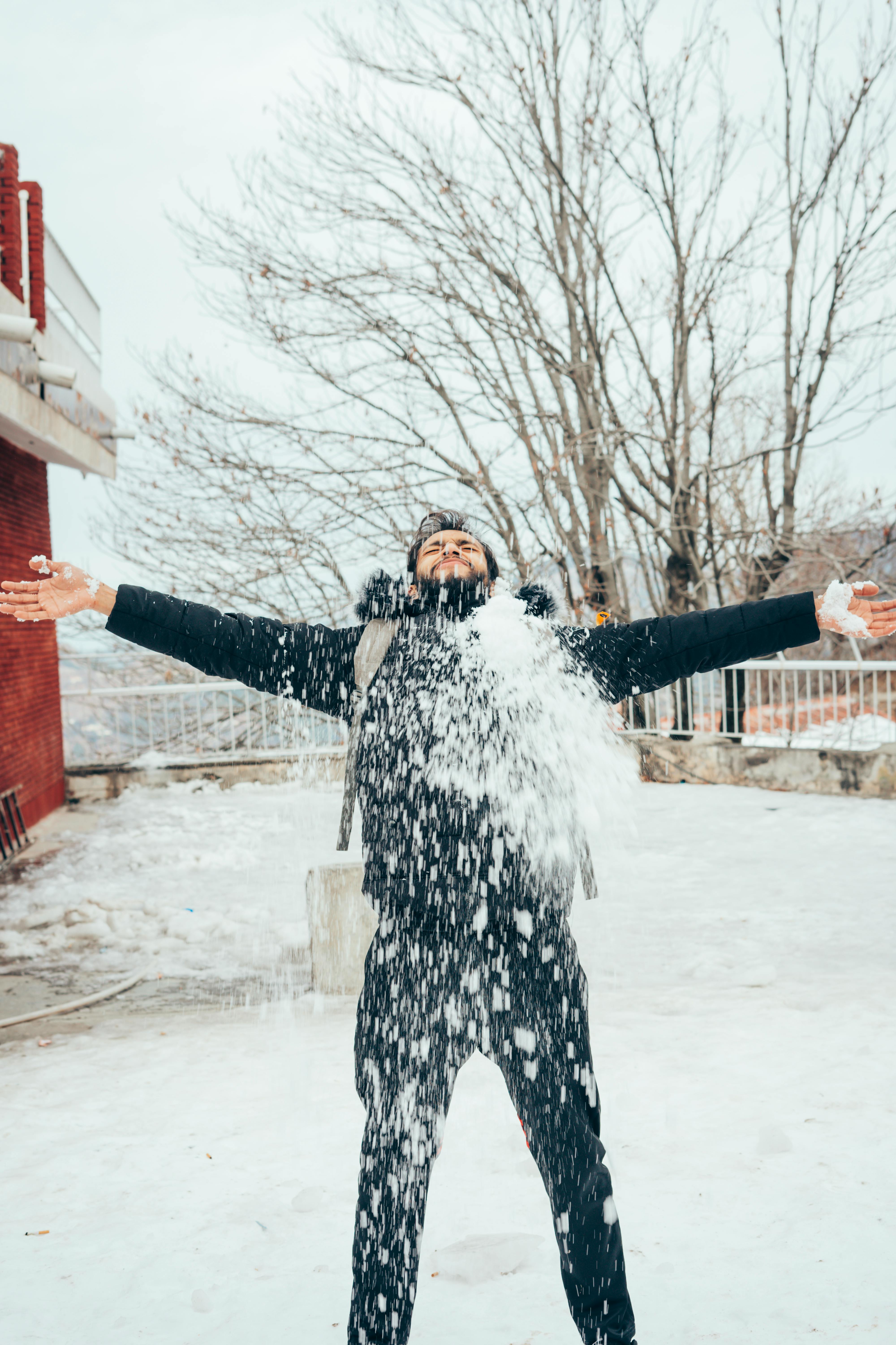Woman Throwing Snow in the Air · Free Stock Photo