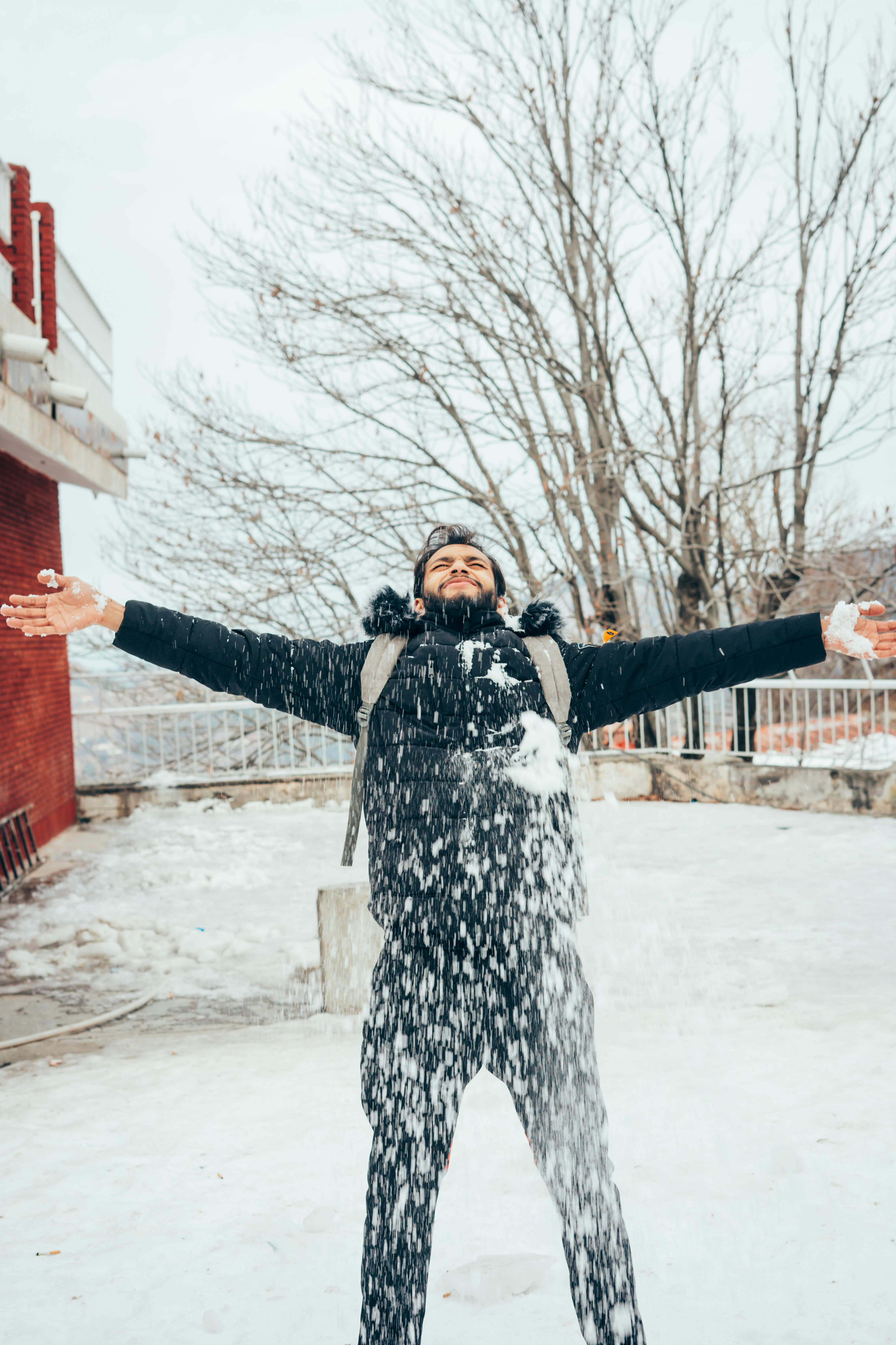 Man Tossing Snow · Free Stock Photo