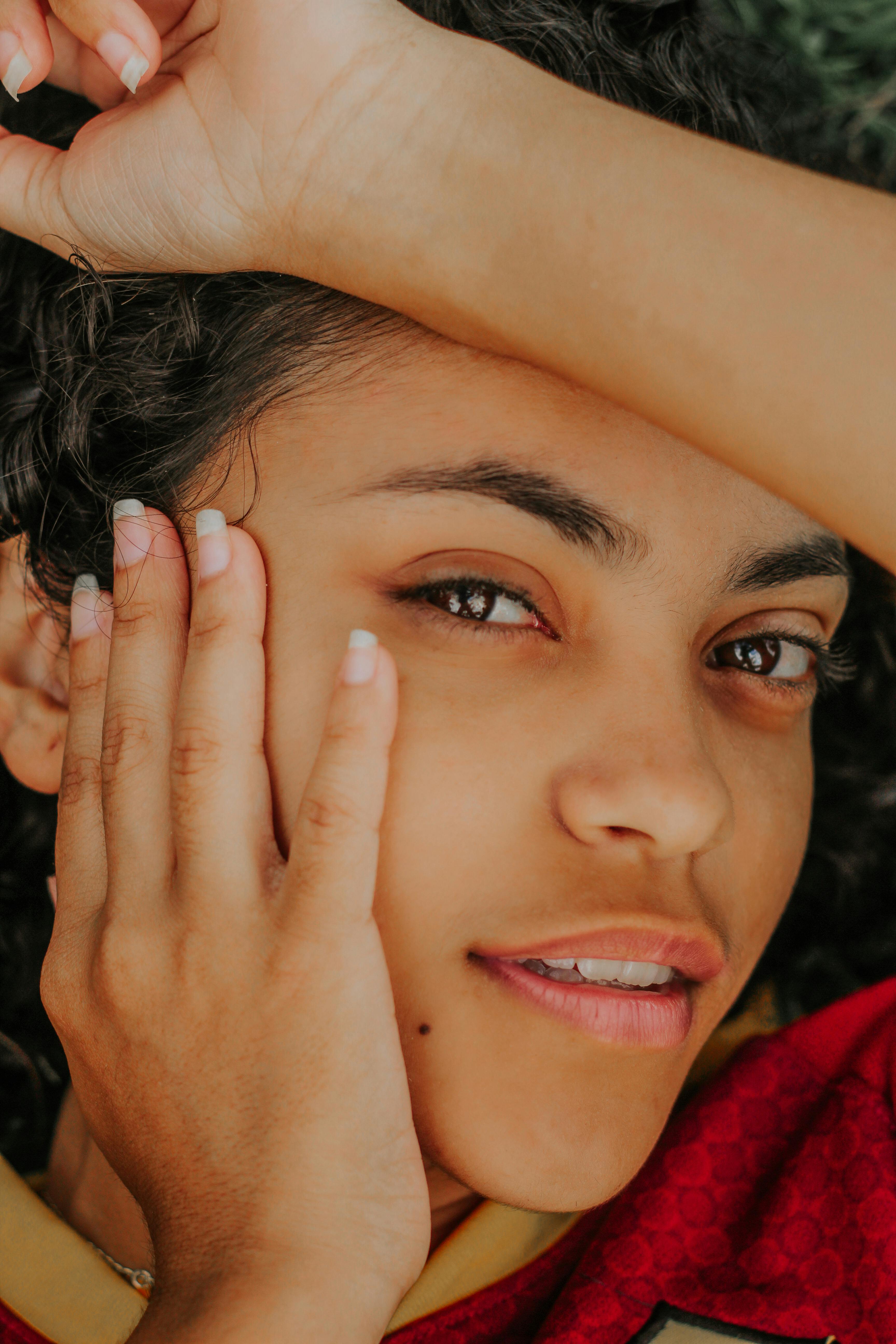 Woman Face with Hand on Cheek and Hair · Free Stock Photo