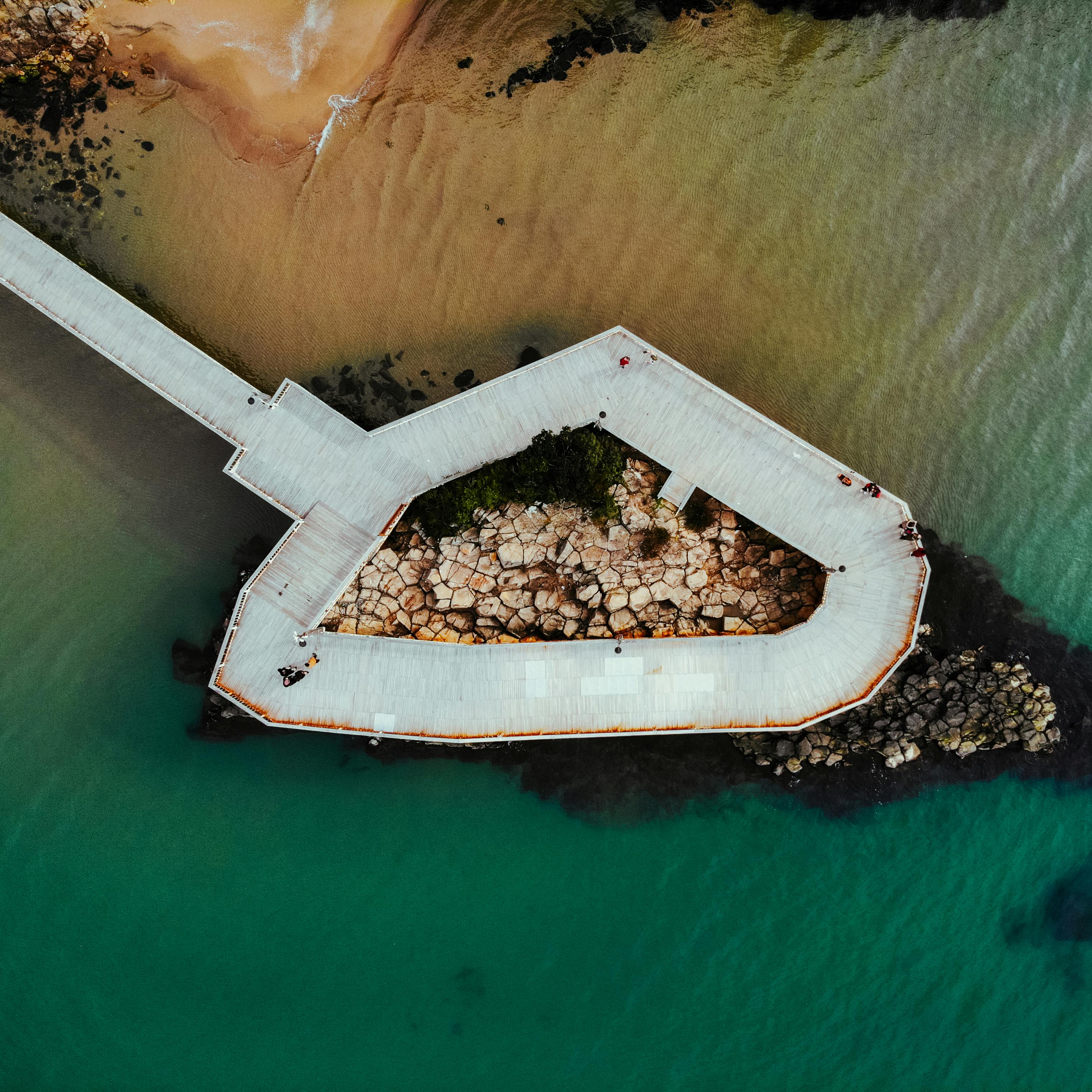Birds Eye View of Sunlit Pier · Free Stock Photo