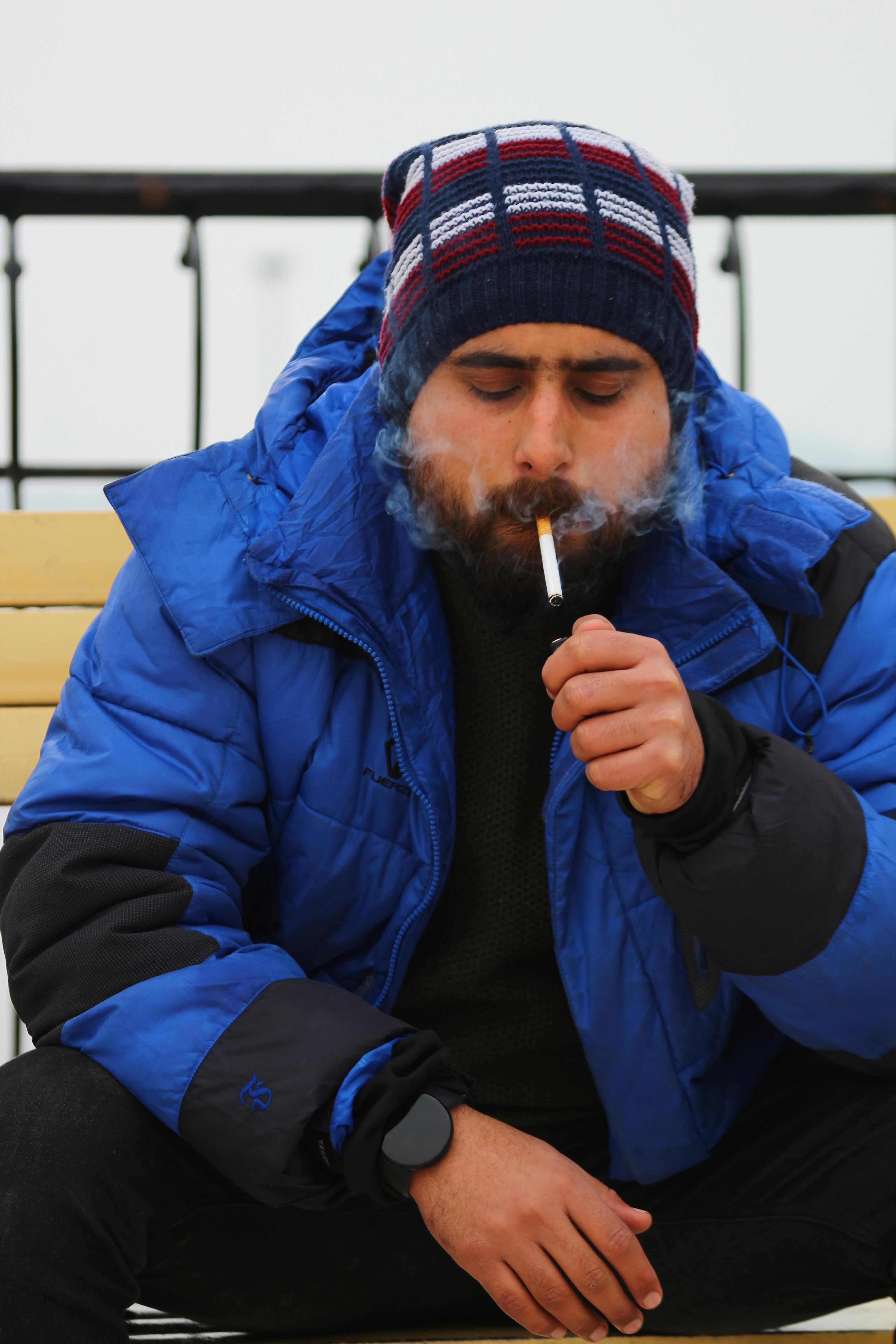 A Man Smoking a Cigarette · Free Stock Photo