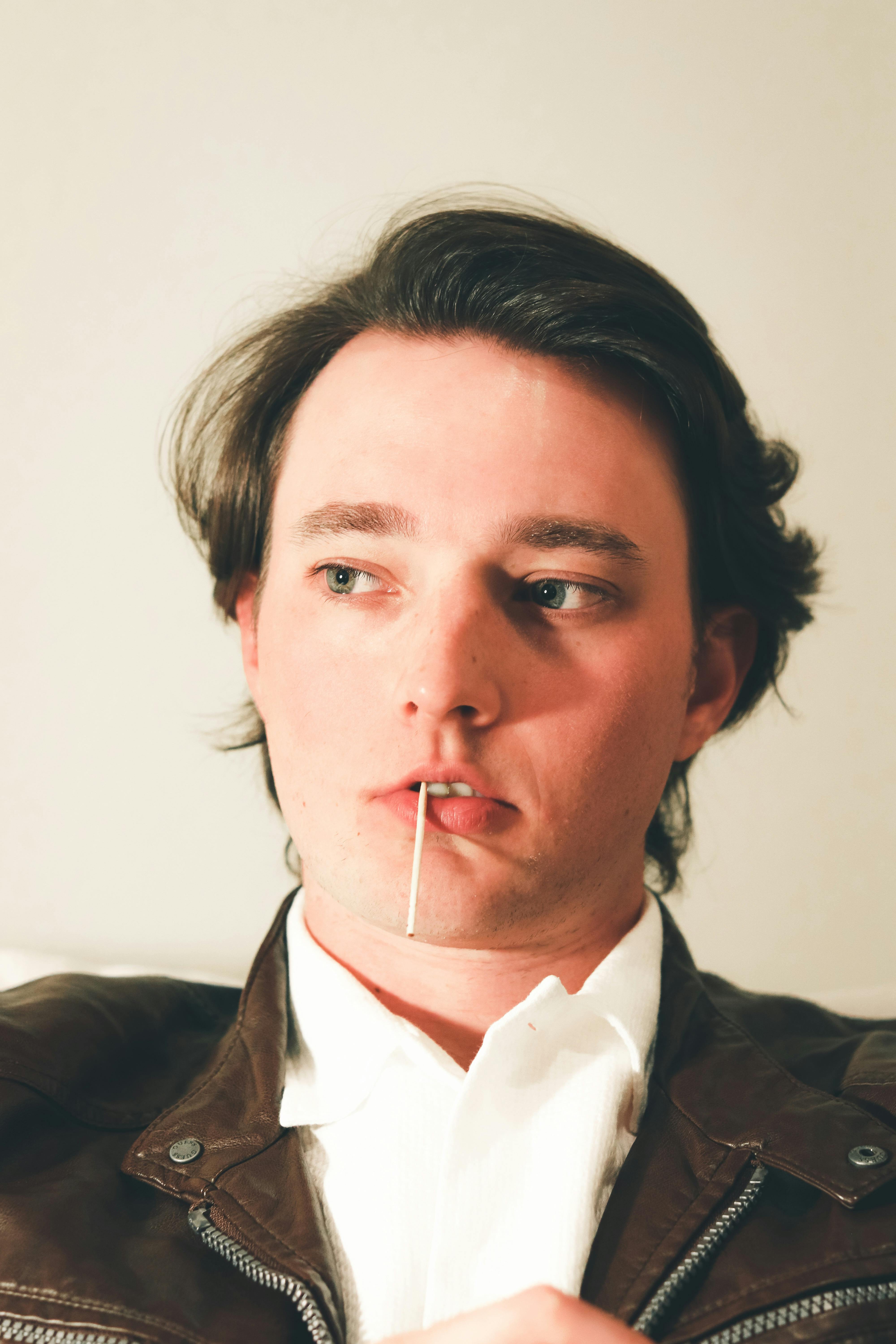 Handsome Man with Toothpick on Mouth · Free Stock Photo