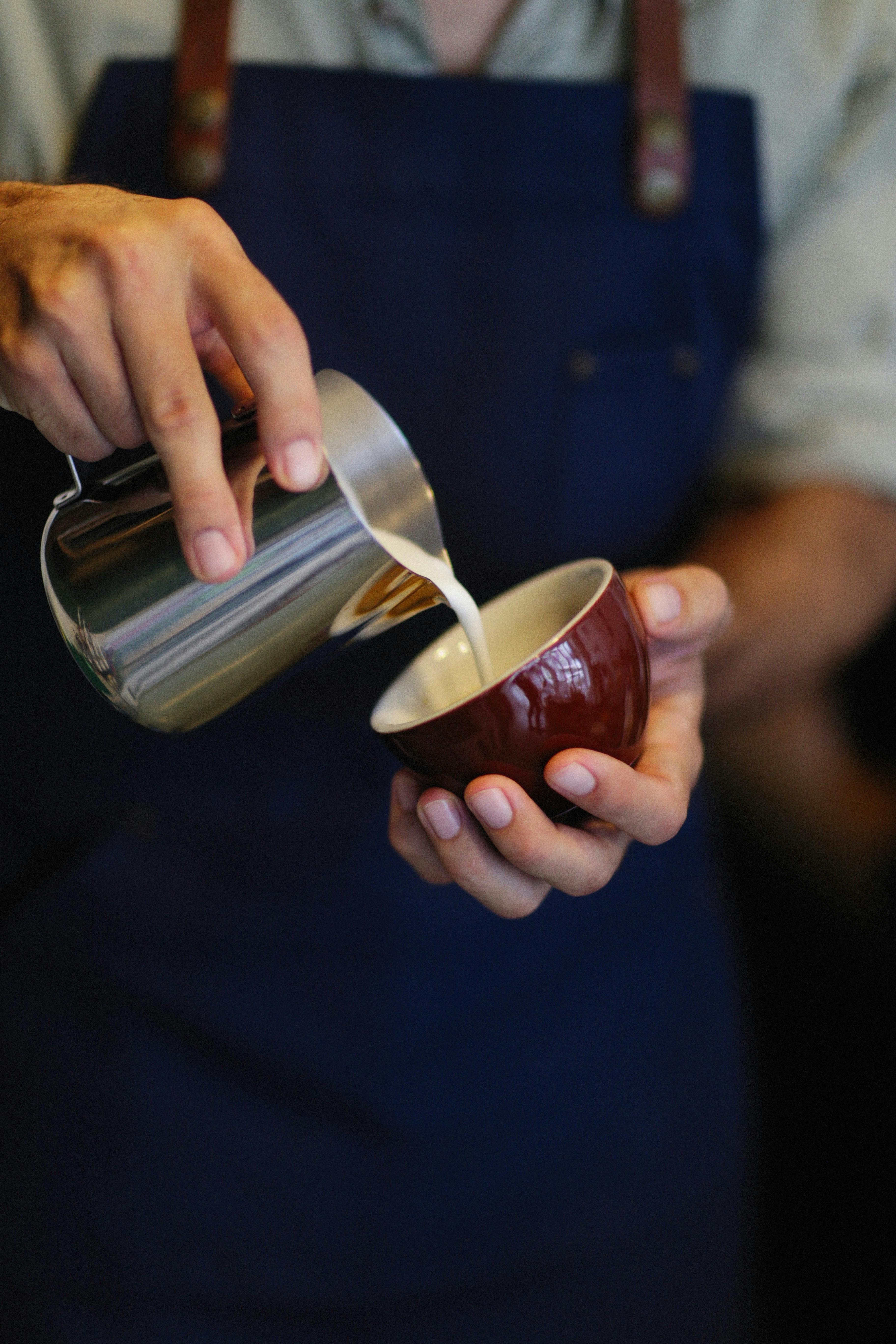 Person Using Espresso Machine · Free Stock Photo