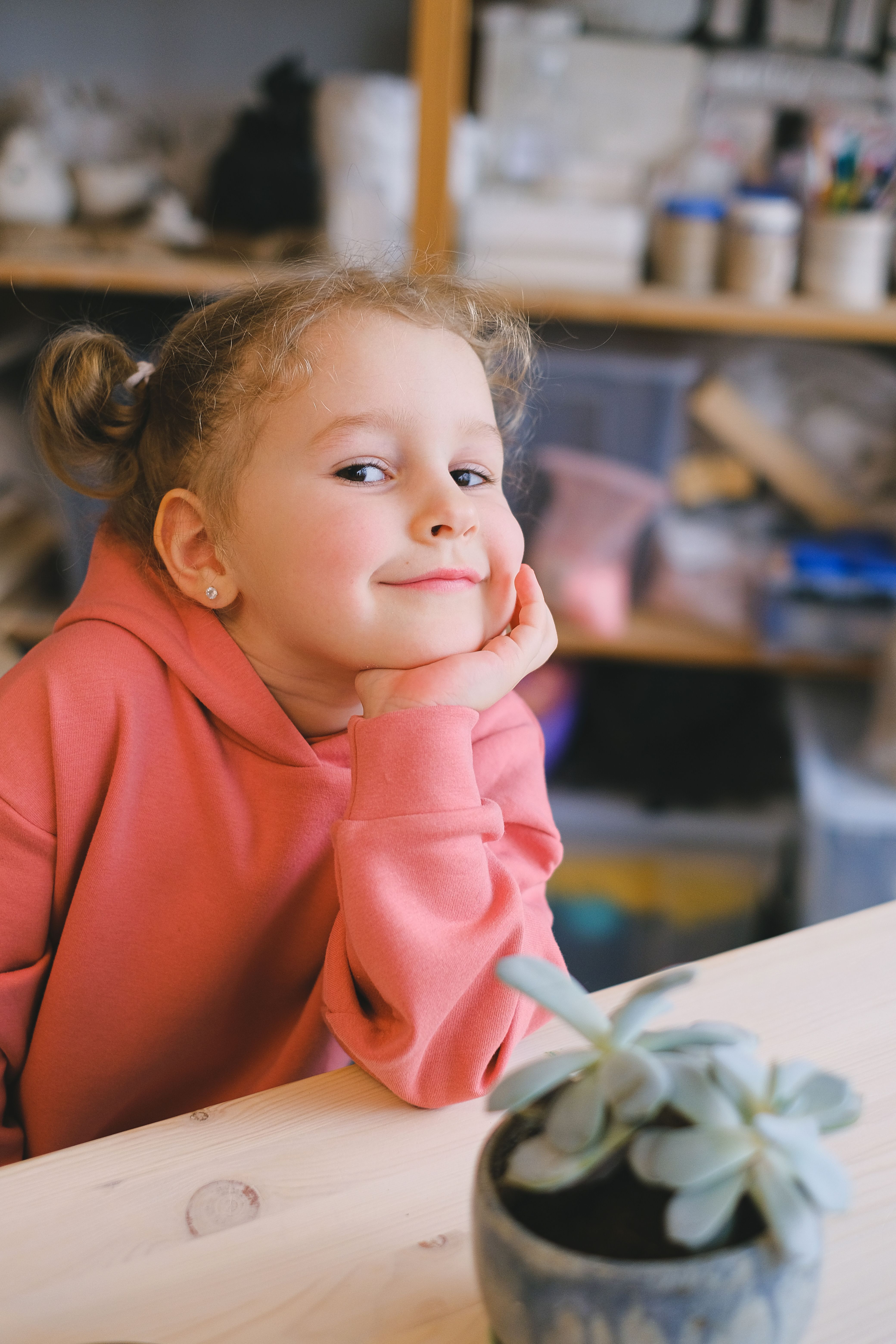 Cute Girl with Hand on Chin · Free Stock Photo