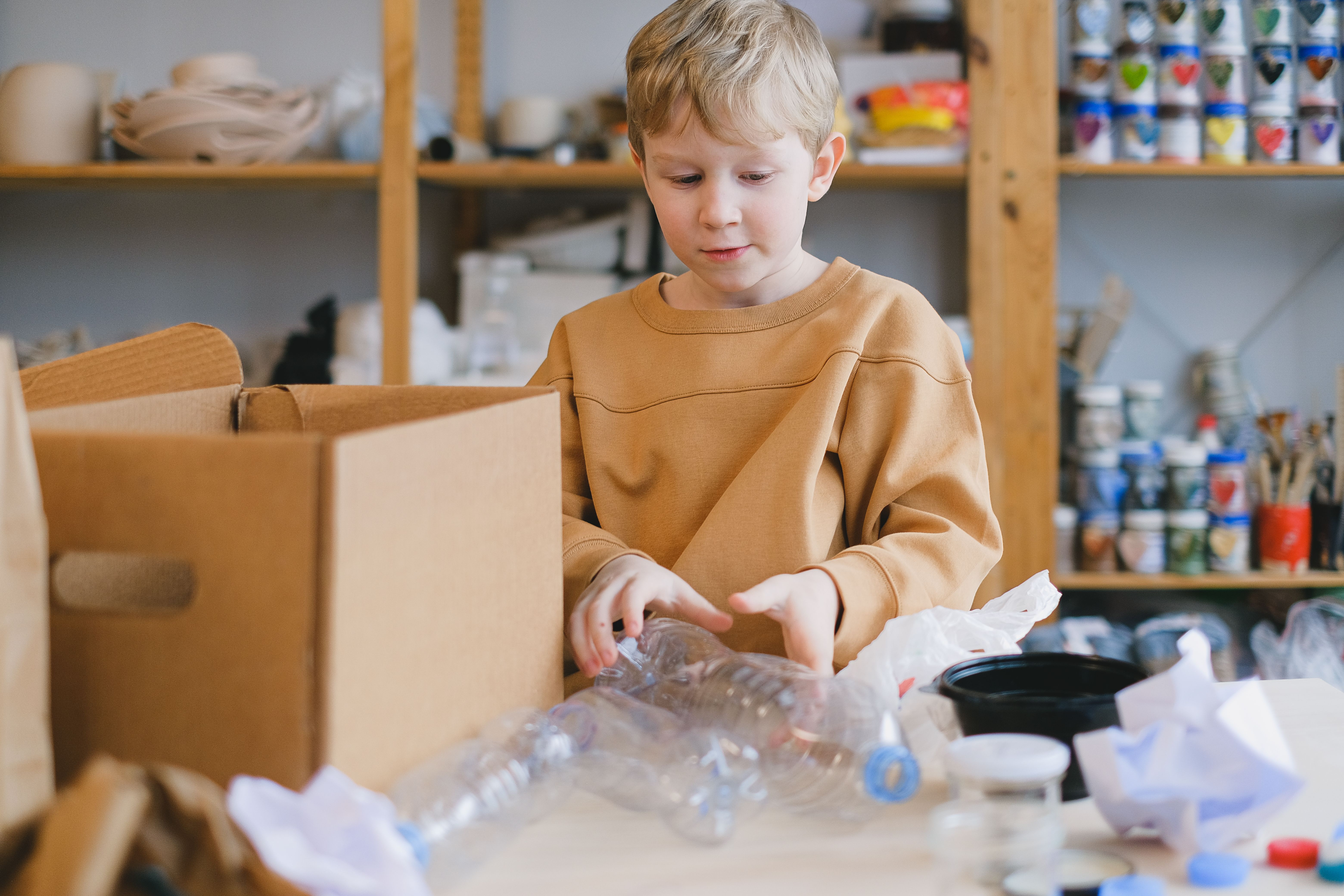 Boy Playing with Plastic Bottles · Free Stock Photo