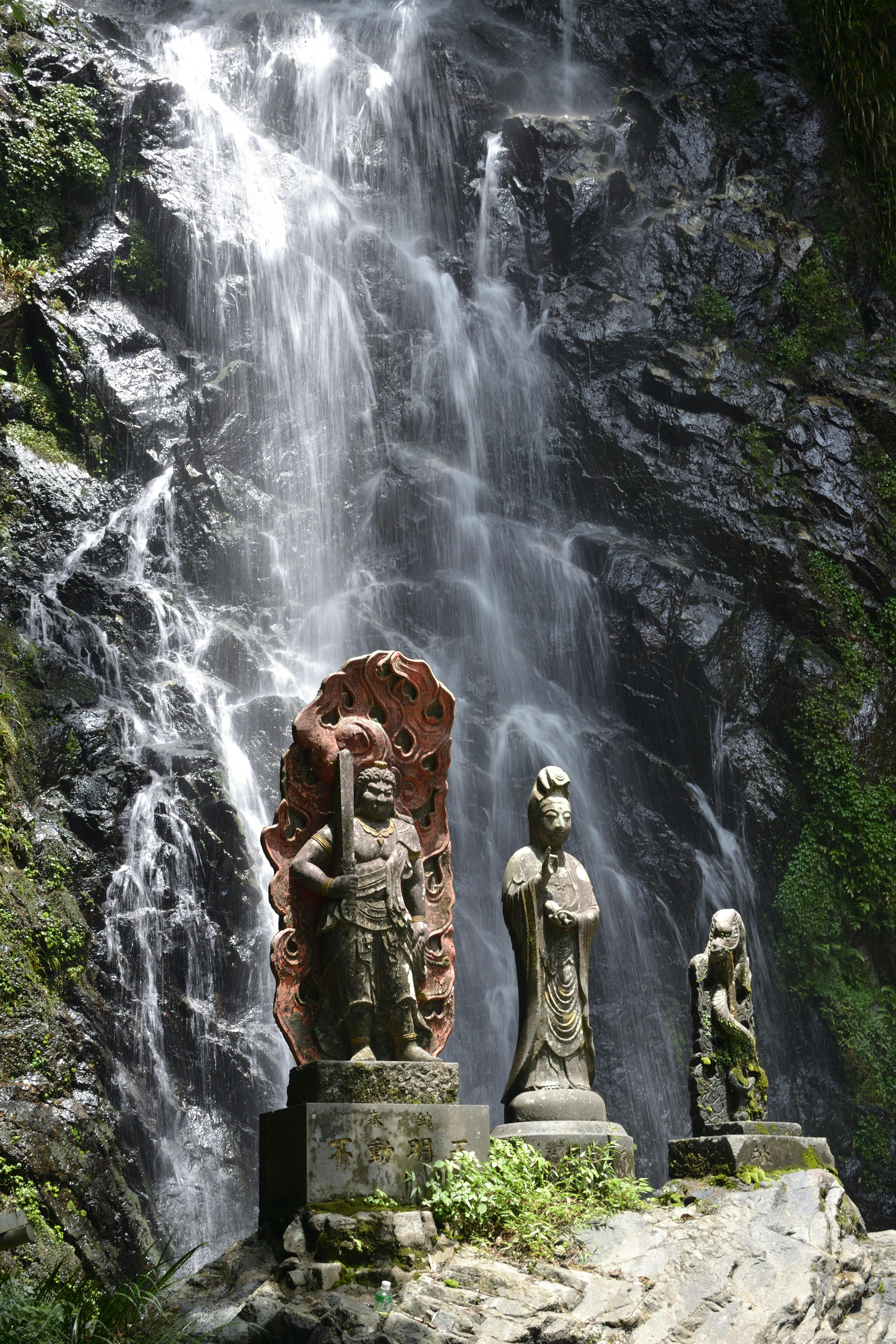 Religious Statues against Waterfall · Free Stock Photo