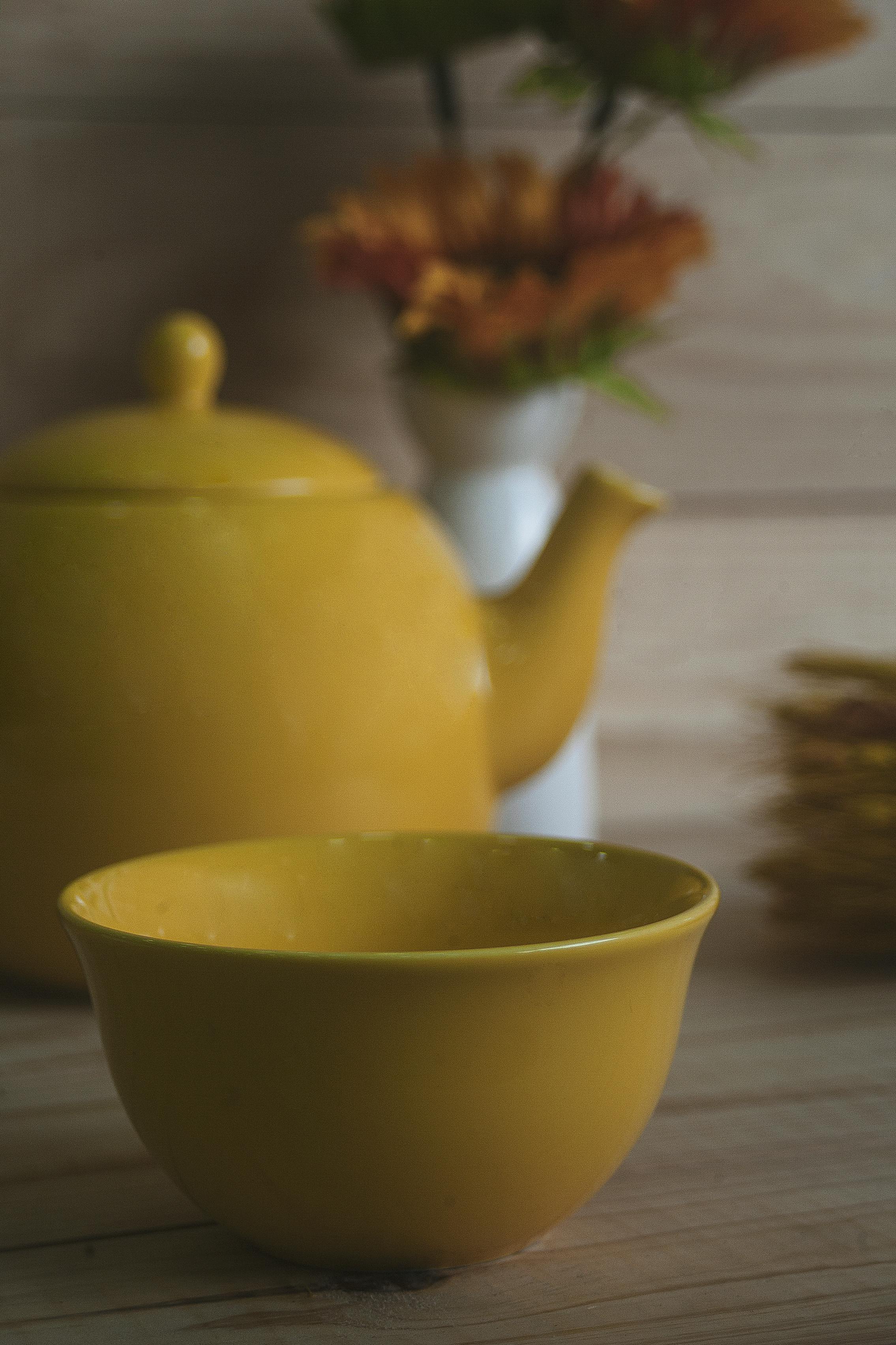 Yellow Ceramic Cup on Wooden Surface · Free Stock Photo