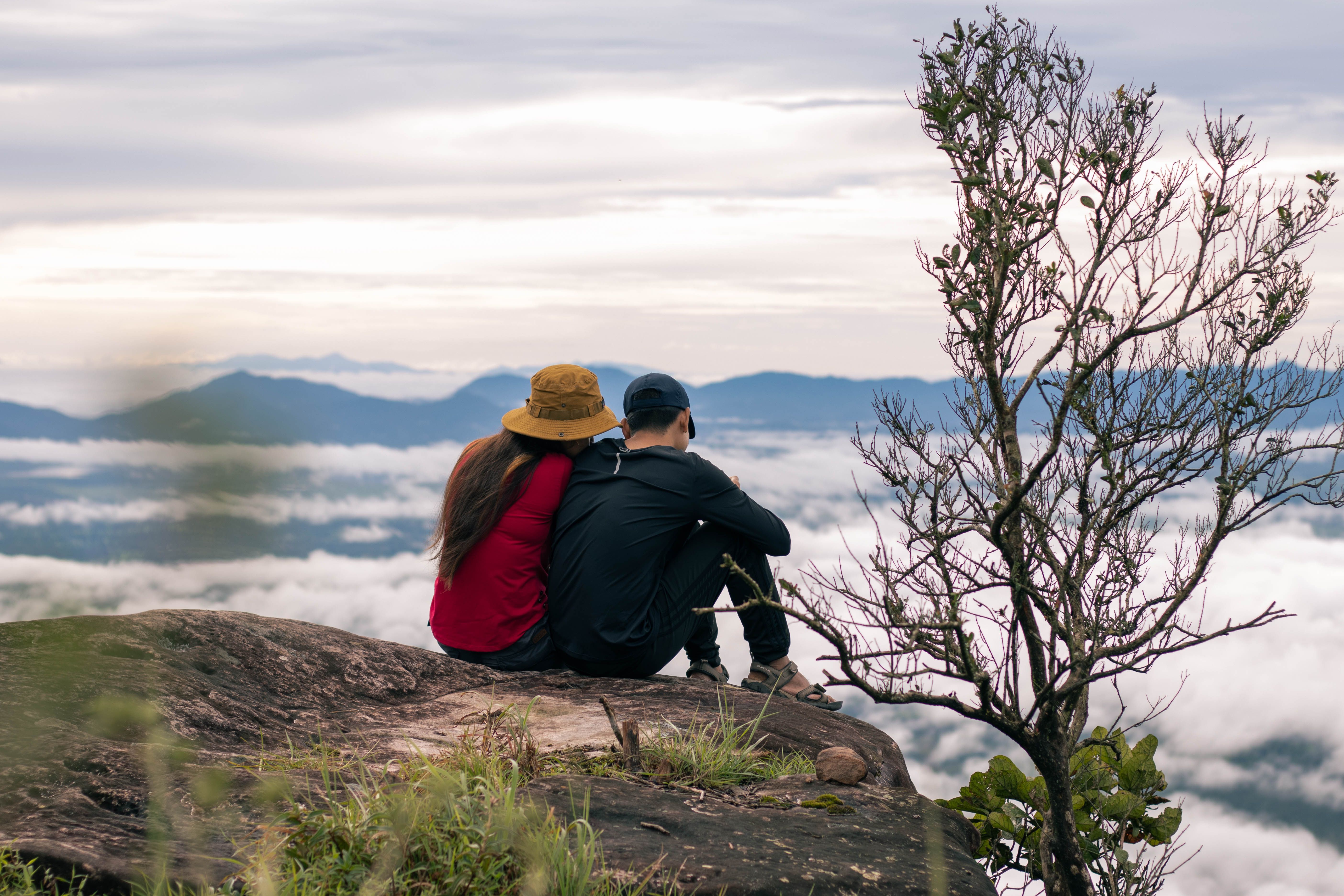 Person in Wooden Balcony Overlooking Mountains · Free Stock Photo