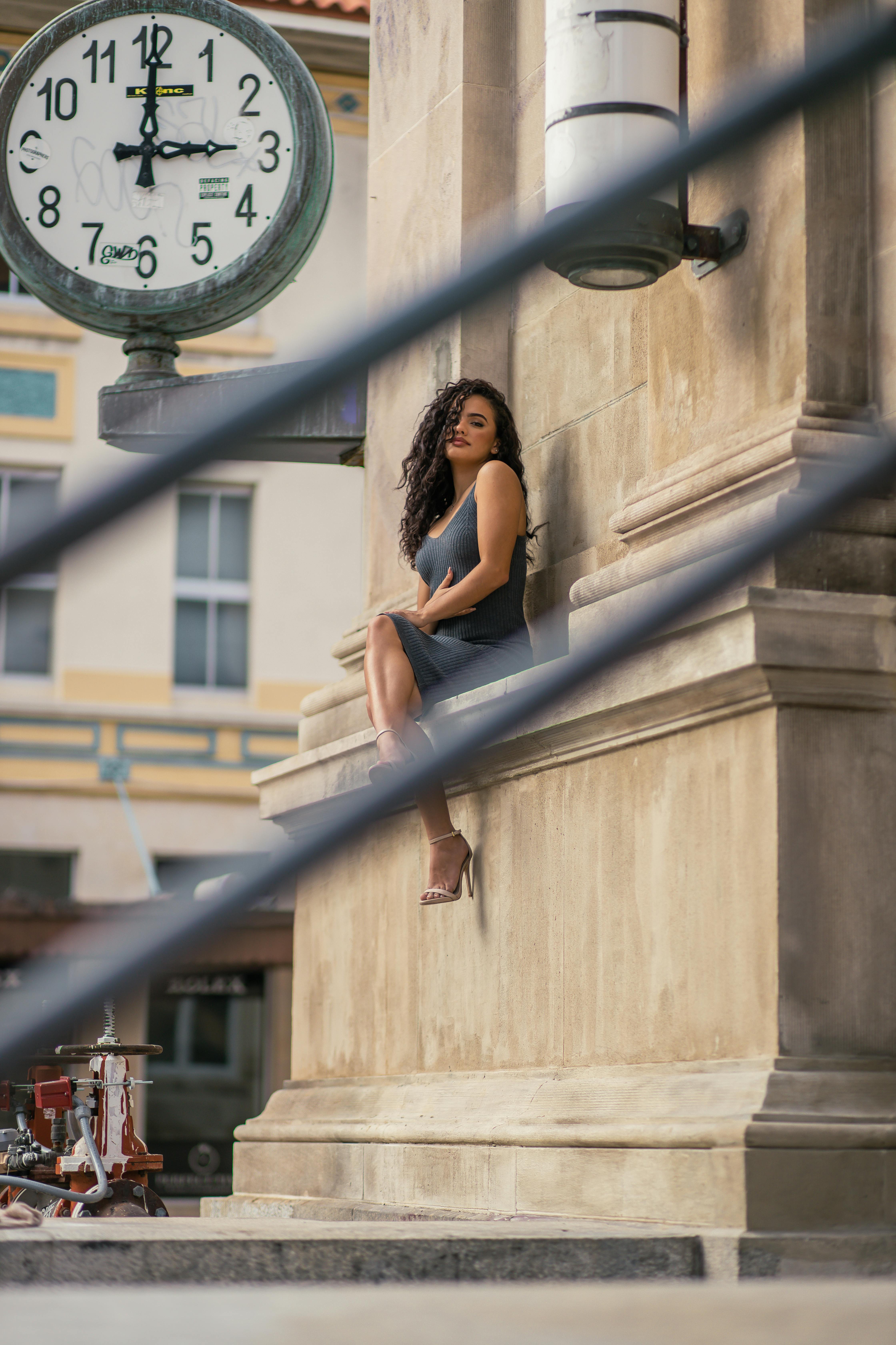 Woman Posing on Building Wall · Free Stock Photo