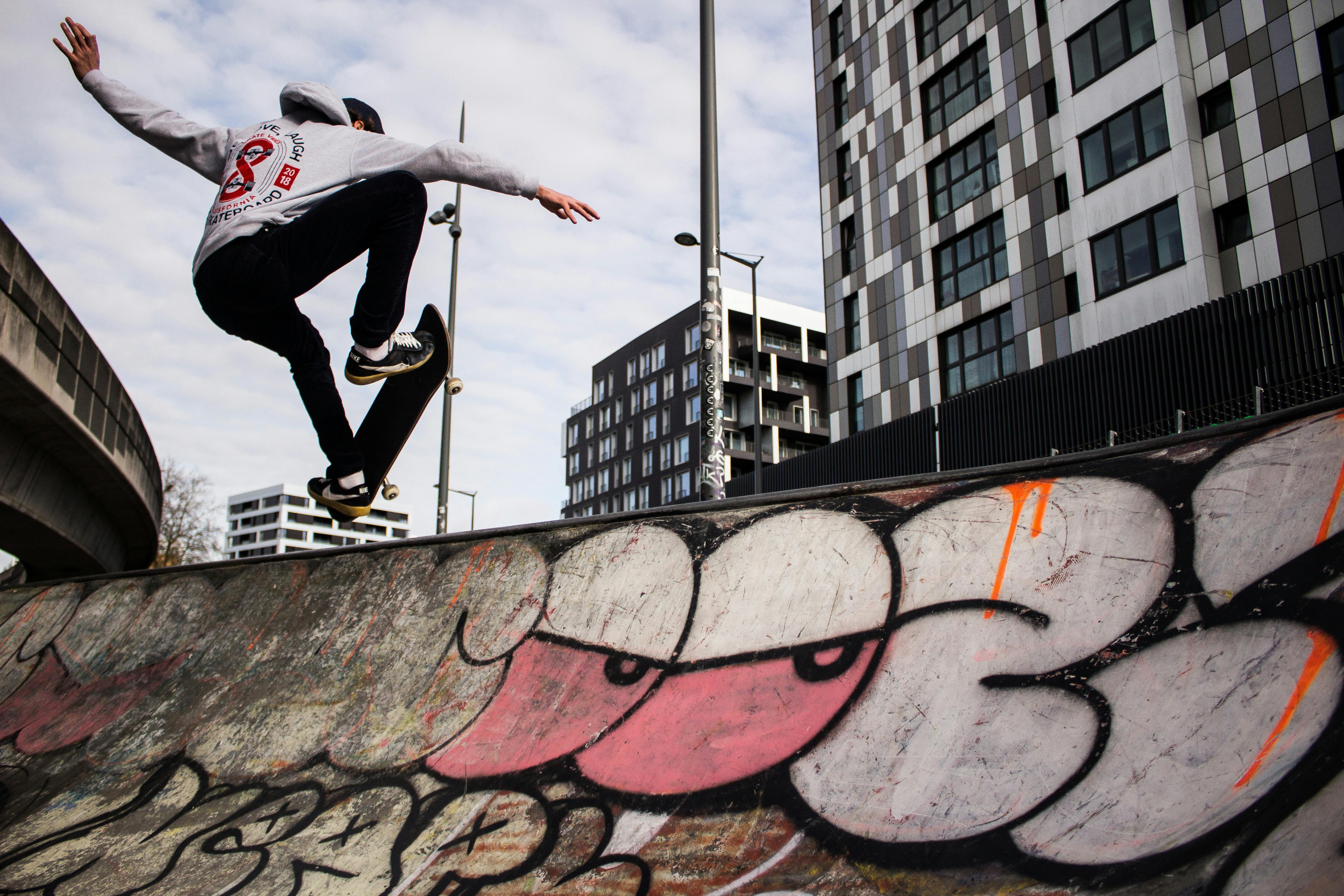 Back View Shot of a Skater Doing Tricks on a Ramp · Free Stock Photo
