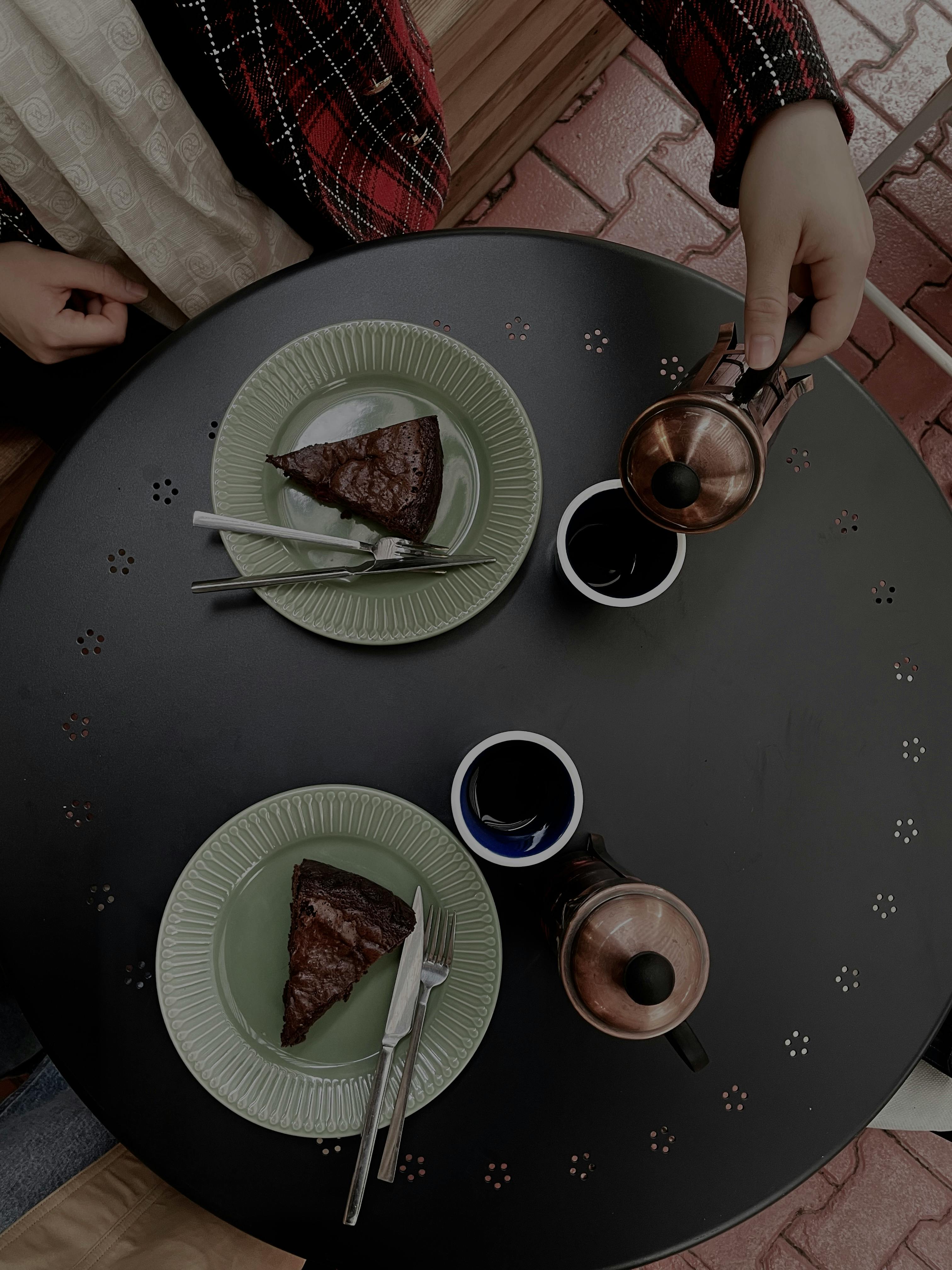 Top View of Coffee and Cake on a Table in a Cafe · Free Stock Photo
