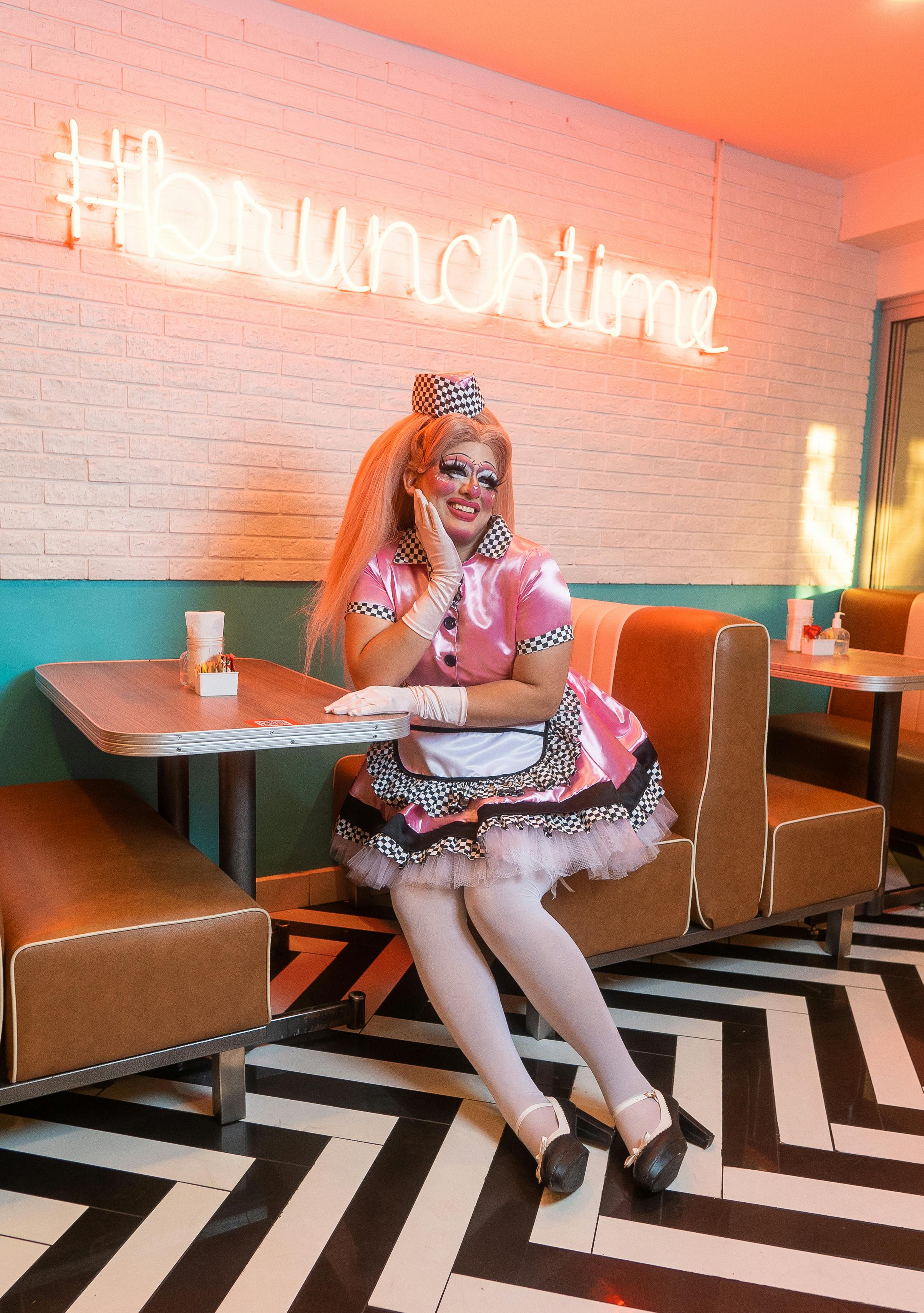 Woman in Pink and Black Waitress Uniform · Free Stock Photo