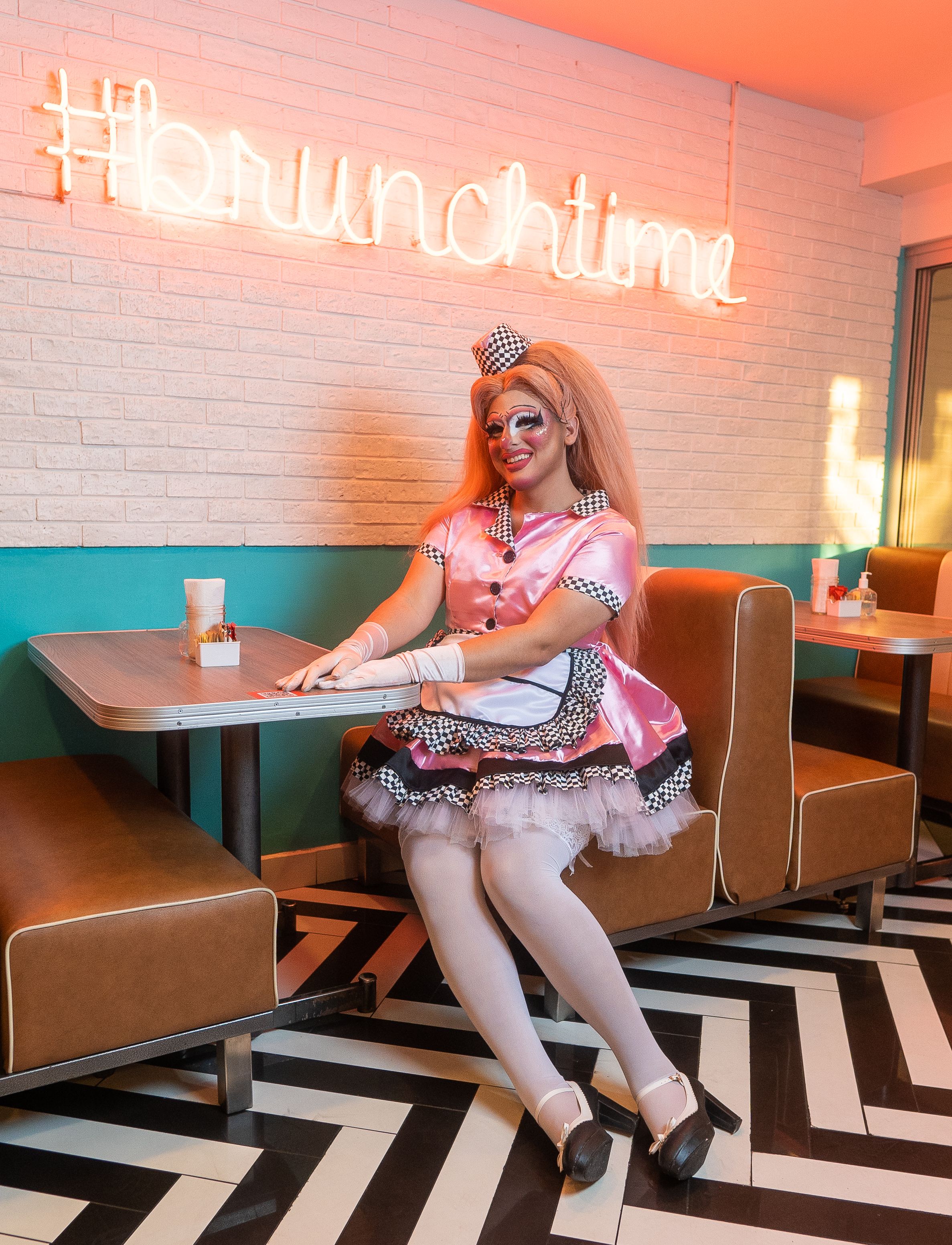 Woman in Pink and Black Waitress Uniform · Free Stock Photo