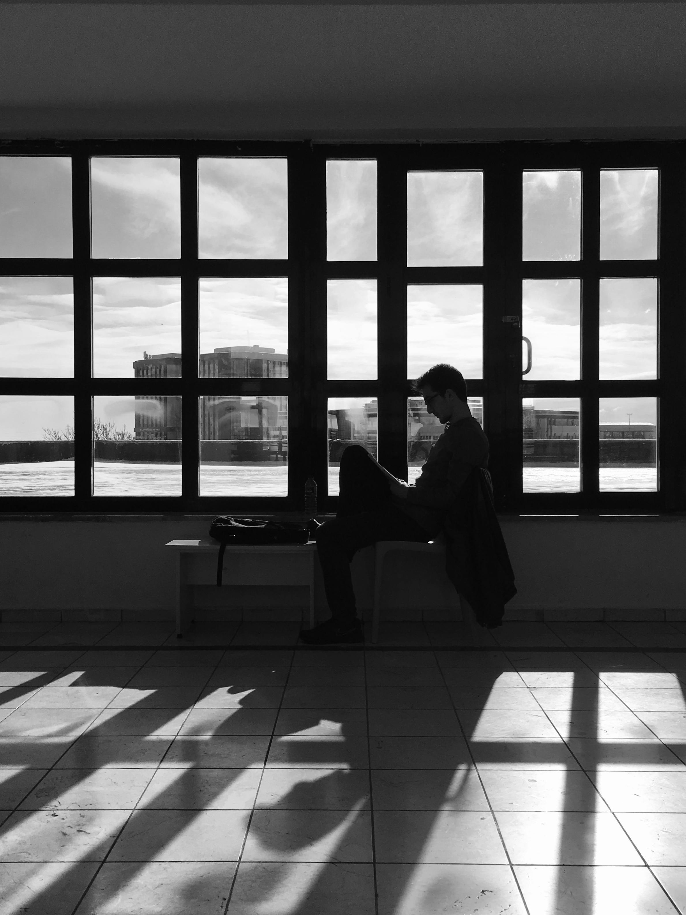 Man Sitting by the Window · Free Stock Photo