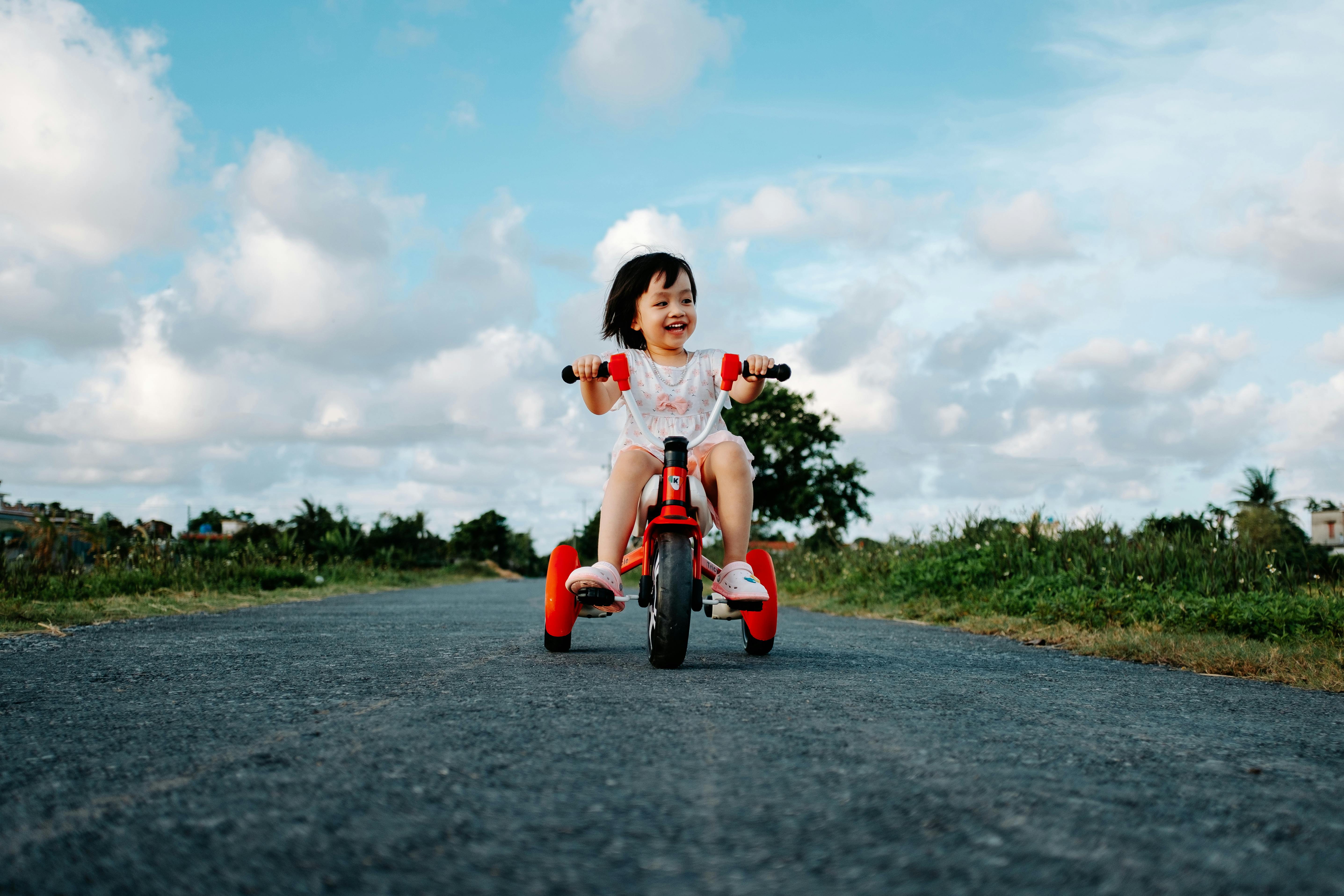 Girl laying on car roof reaching out smiling · Free Stock Photo