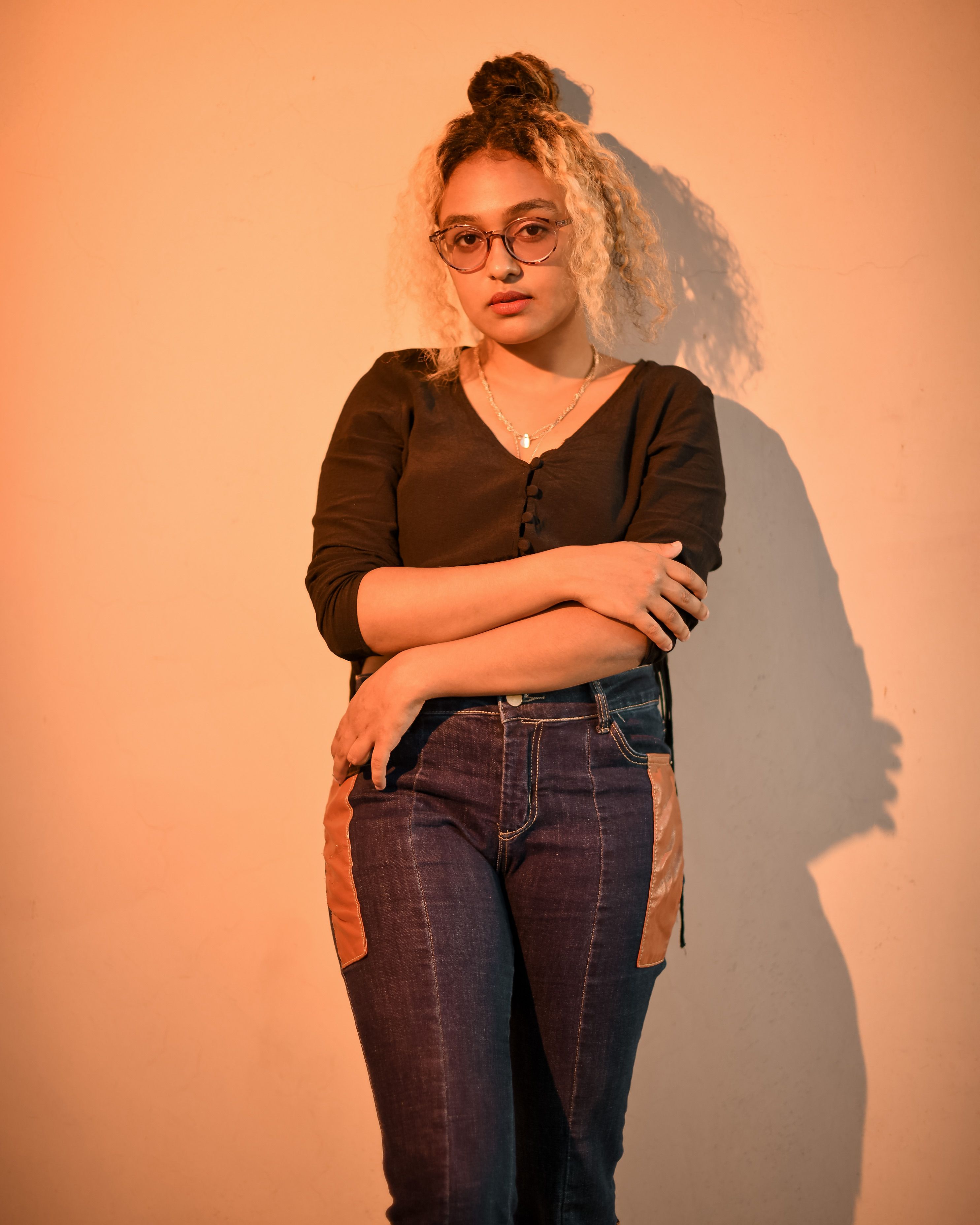 Woman Standing Against a Wall · Free Stock Photo
