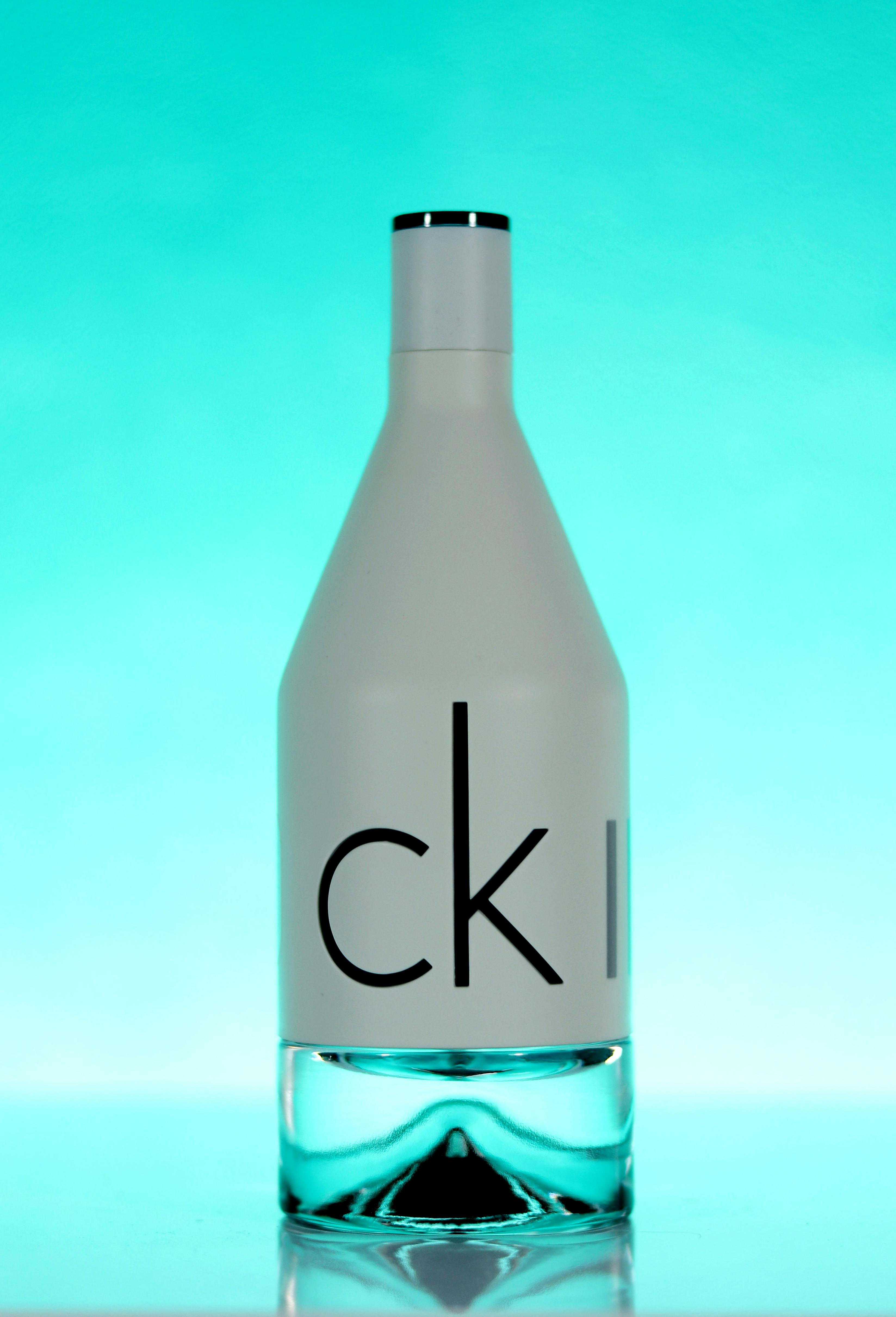 White Perfume Bottle in Close Up Photography · Free Stock Photo