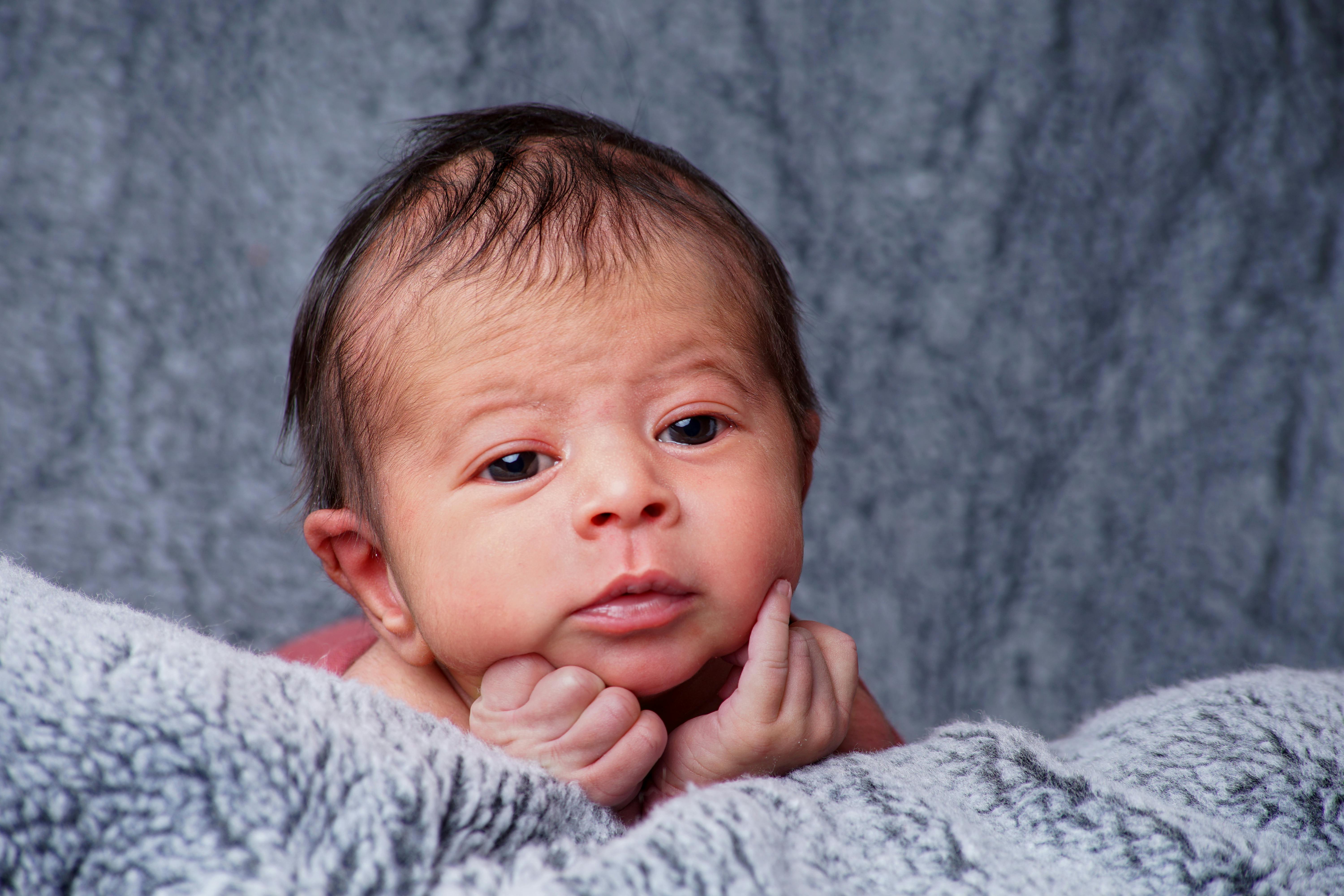Close Up Photo of a Figurine of Baby Jesus in a Manger · Free Stock Photo