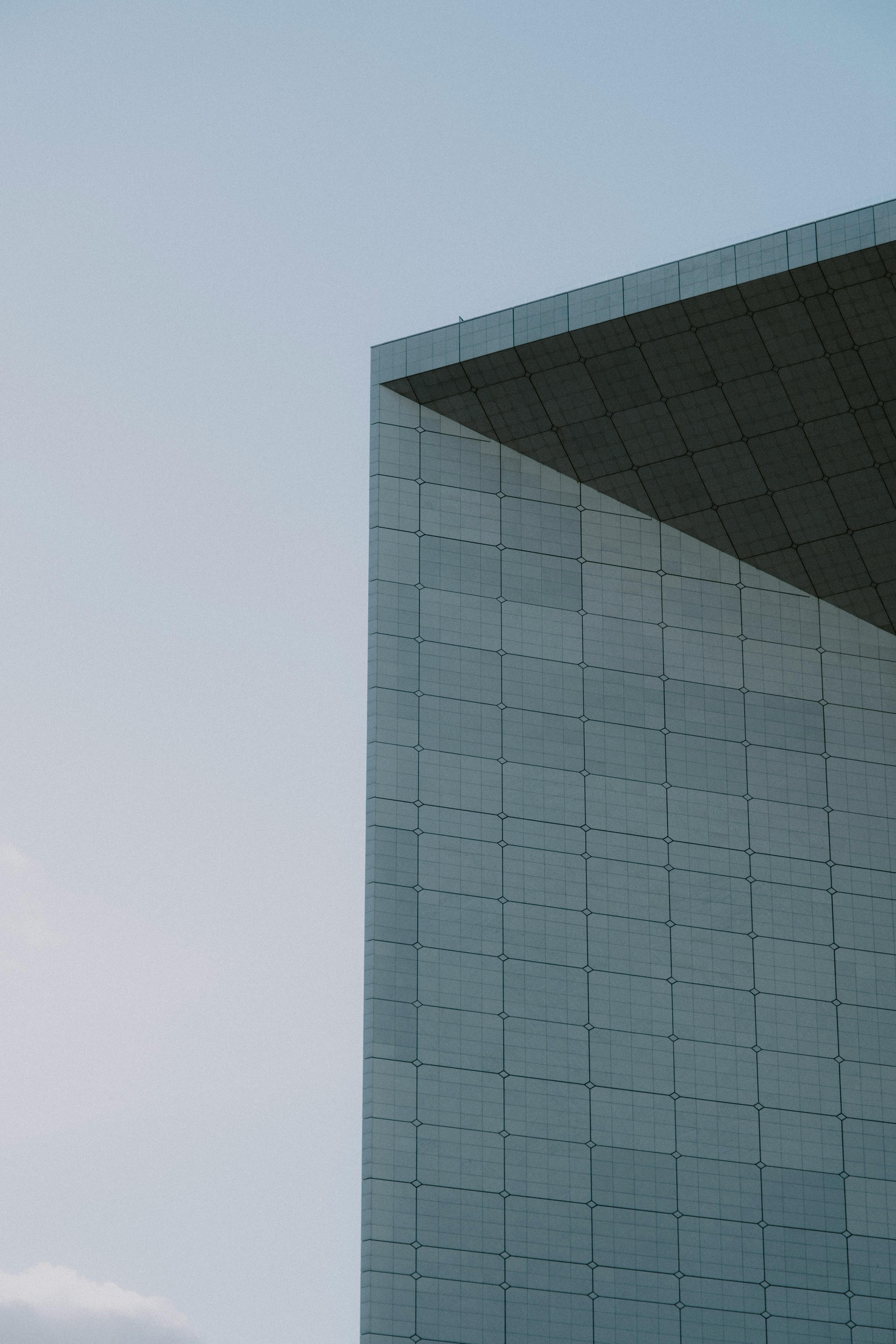 Corner of a Modern Glass Skyscraper · Free Stock Photo