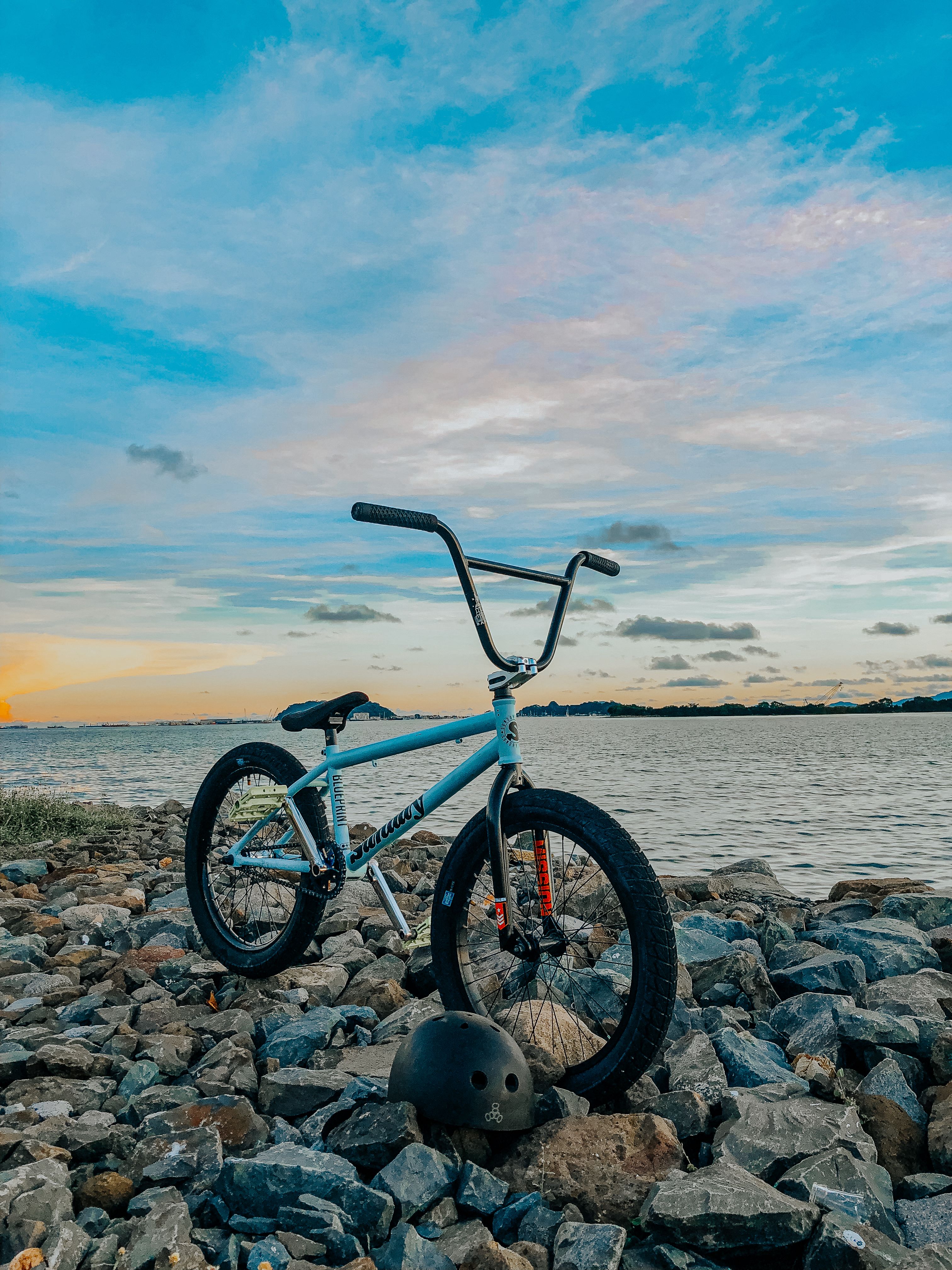Bicycle on Rocky Shore · Free Stock Photo