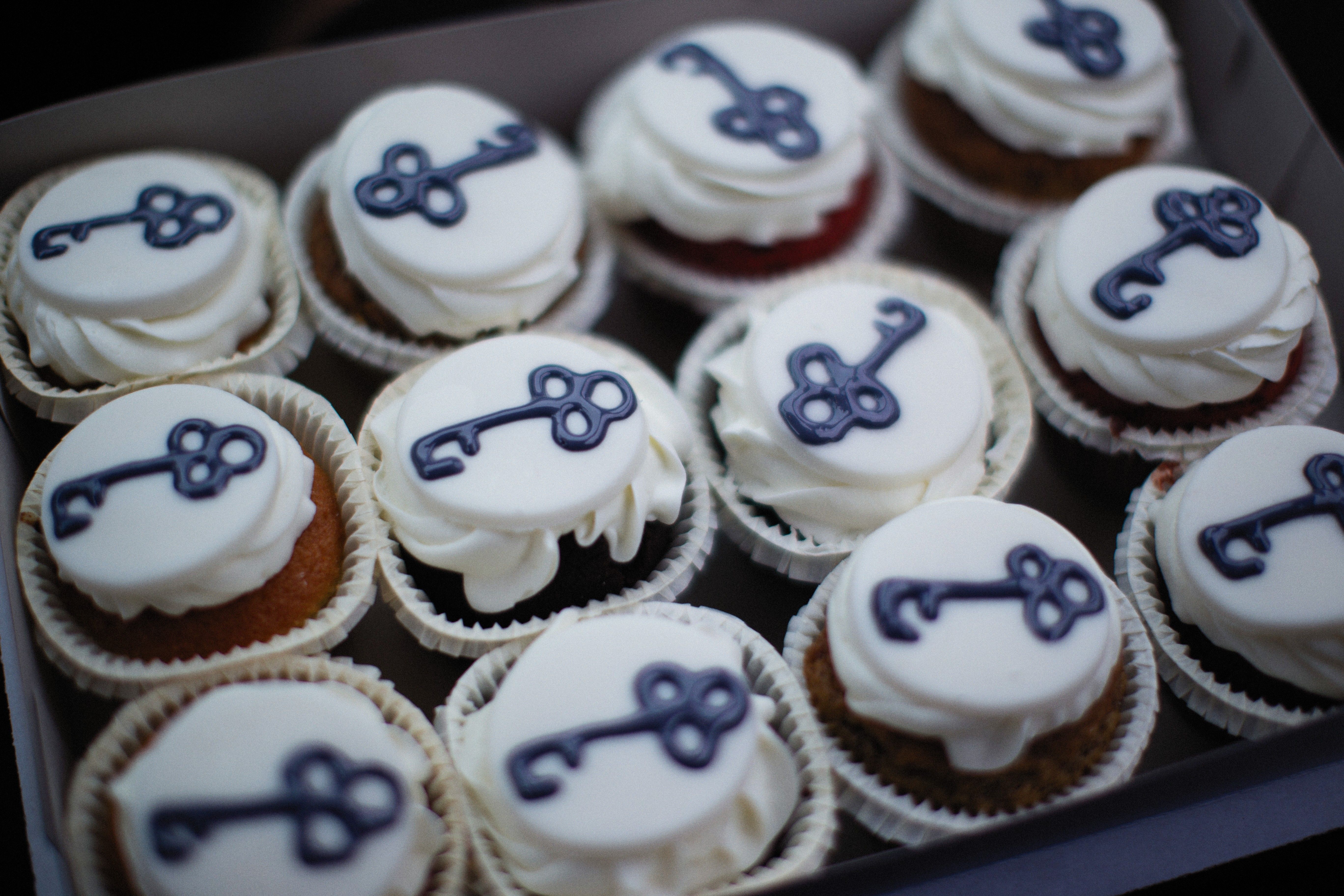 Delicious Cupcakes with Keys on White Icing · Free Stock Photo