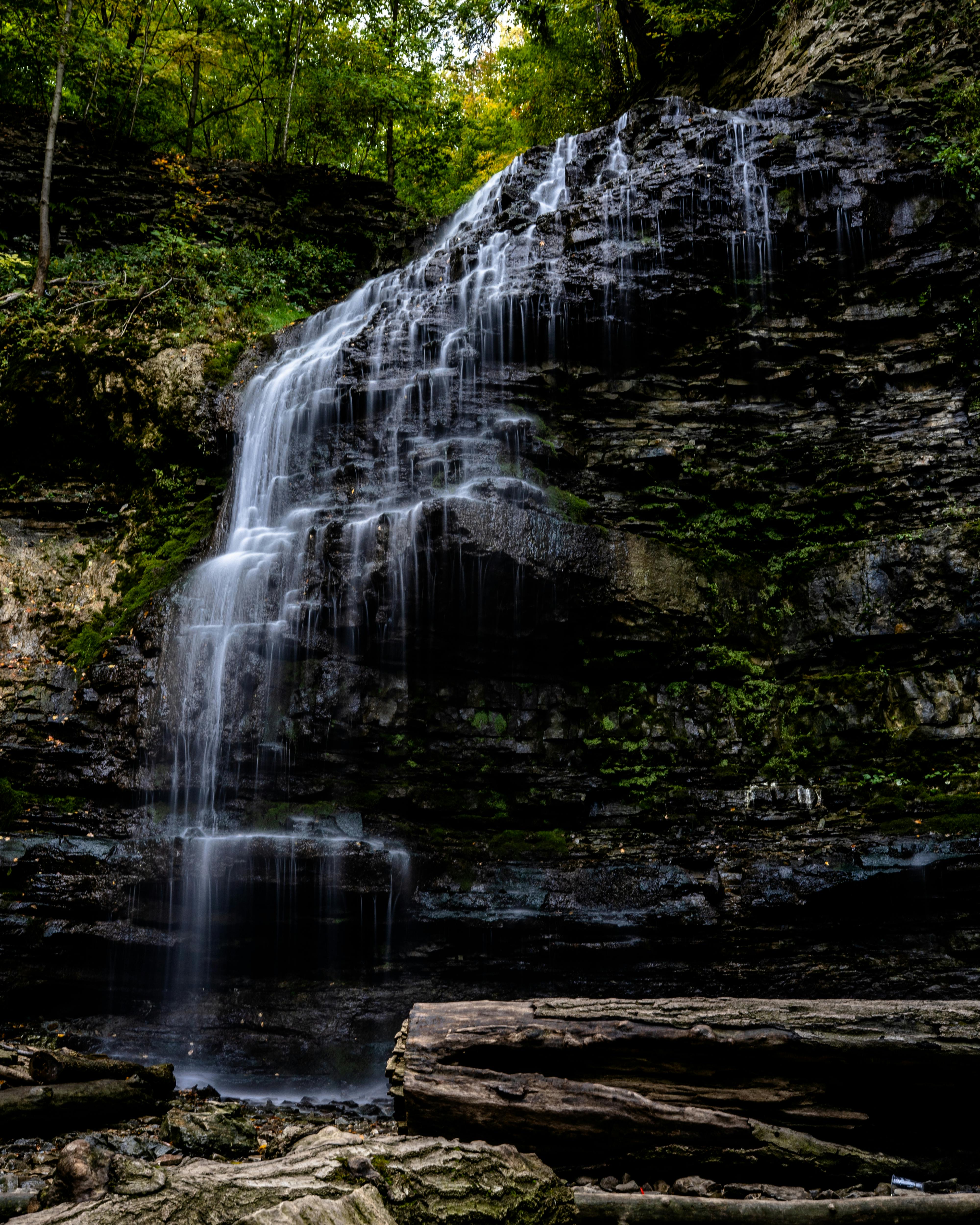 A Person Under The Flowing Waterfall · Free Stock Photo