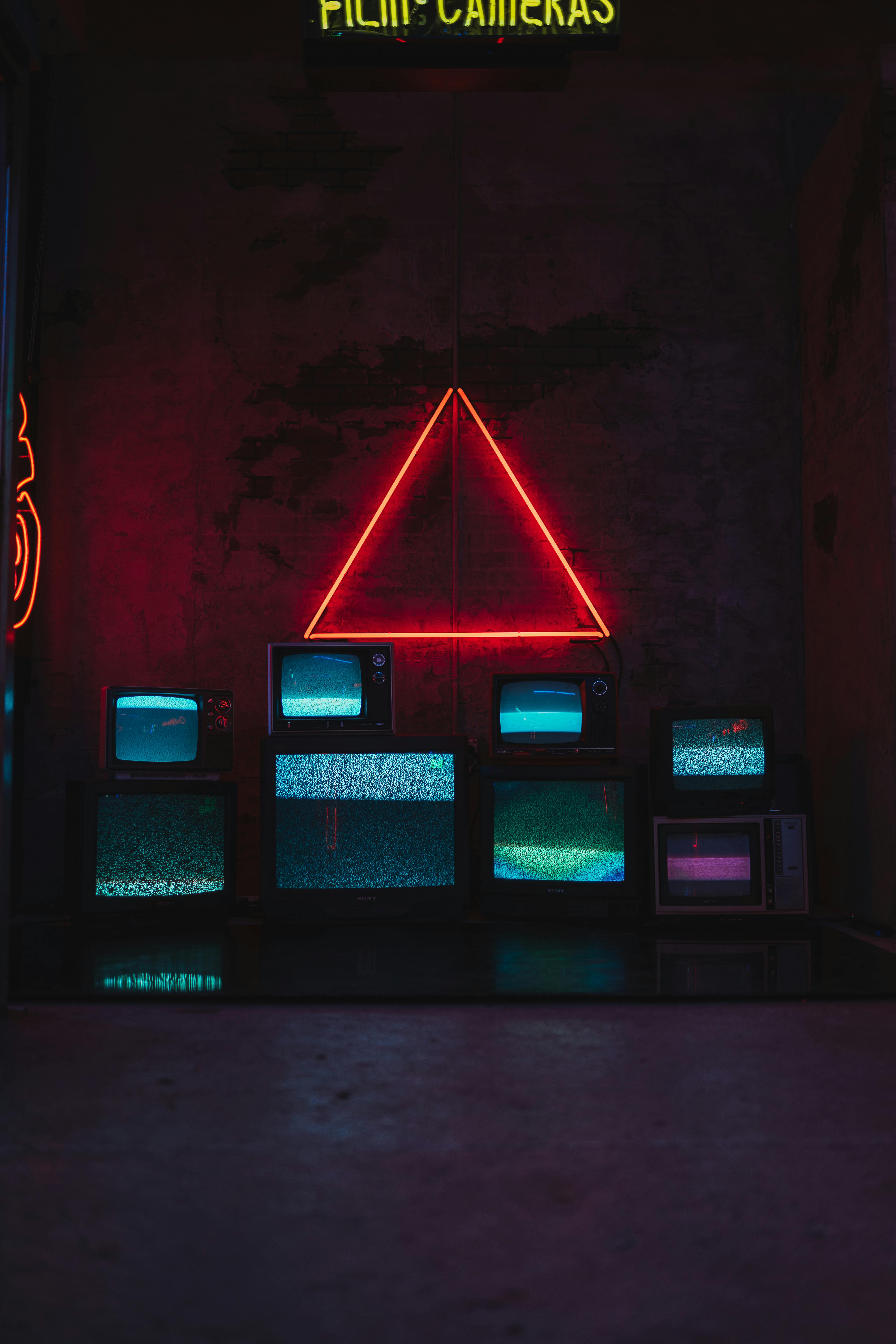Neon Signs on Top of Televisions · Free Stock Photo