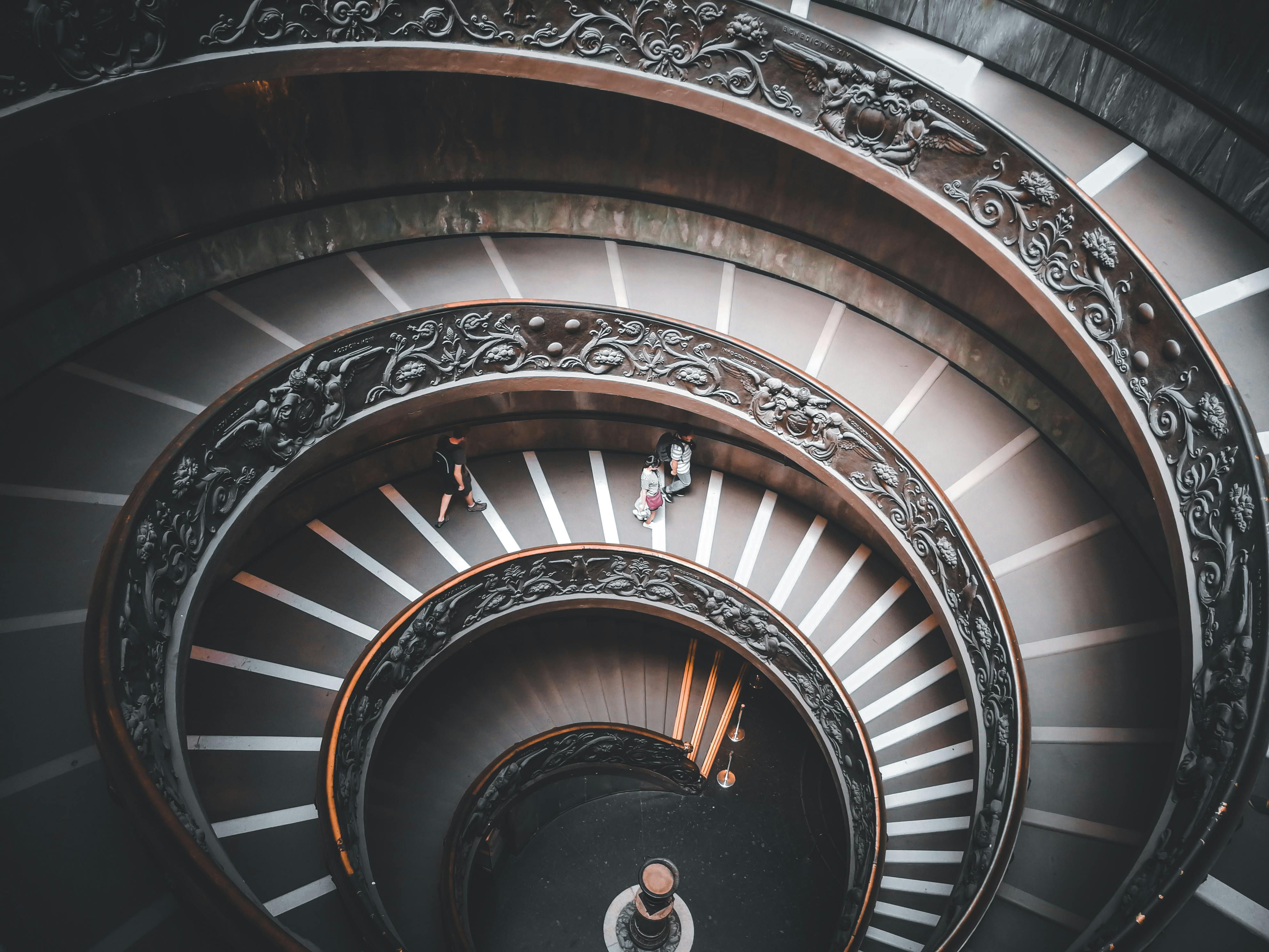 People Ascending Spiral Staircase · Free Stock Photo
