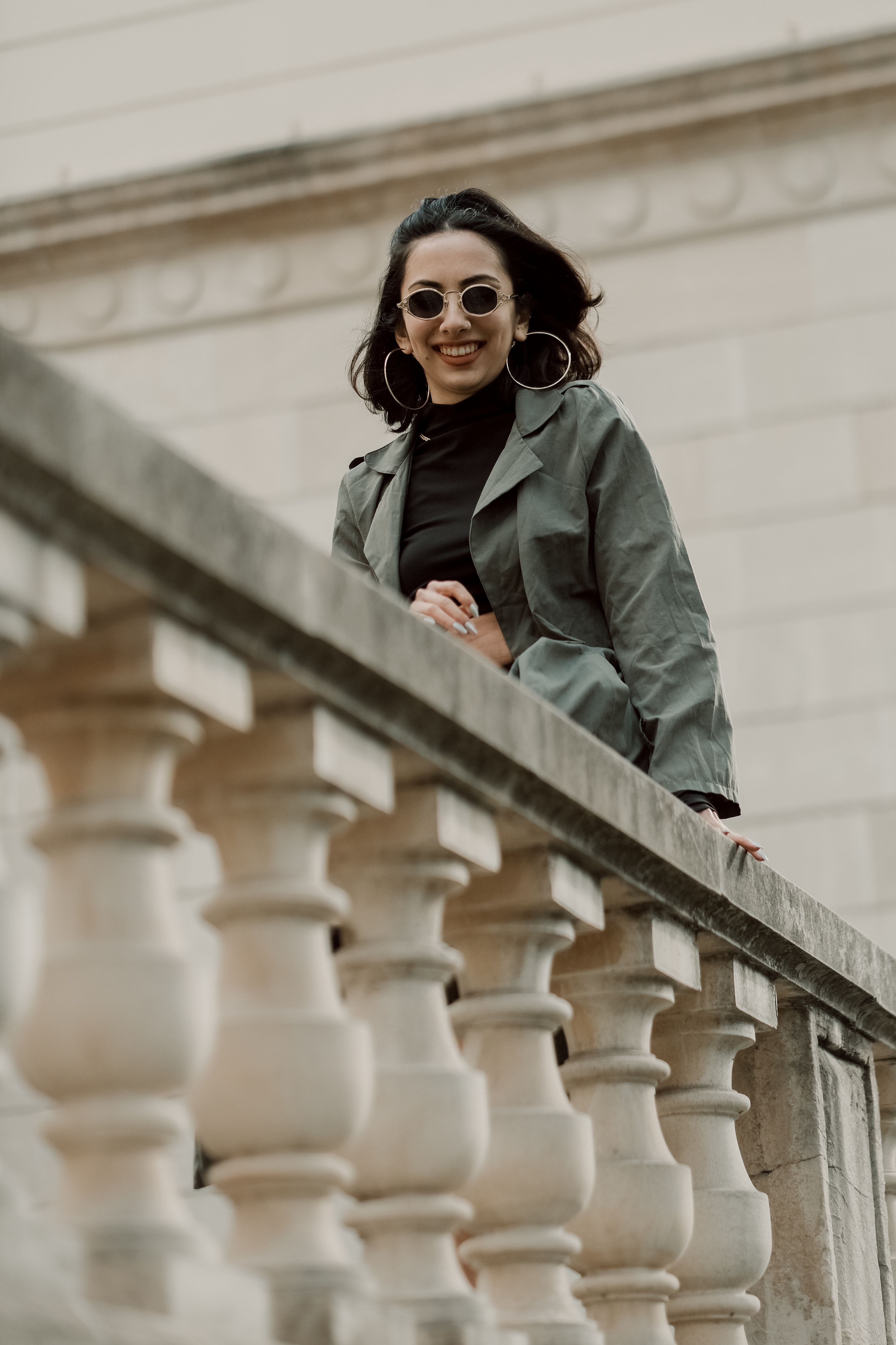 A Woman in Gray Coat Near the Ledge · Free Stock Photo