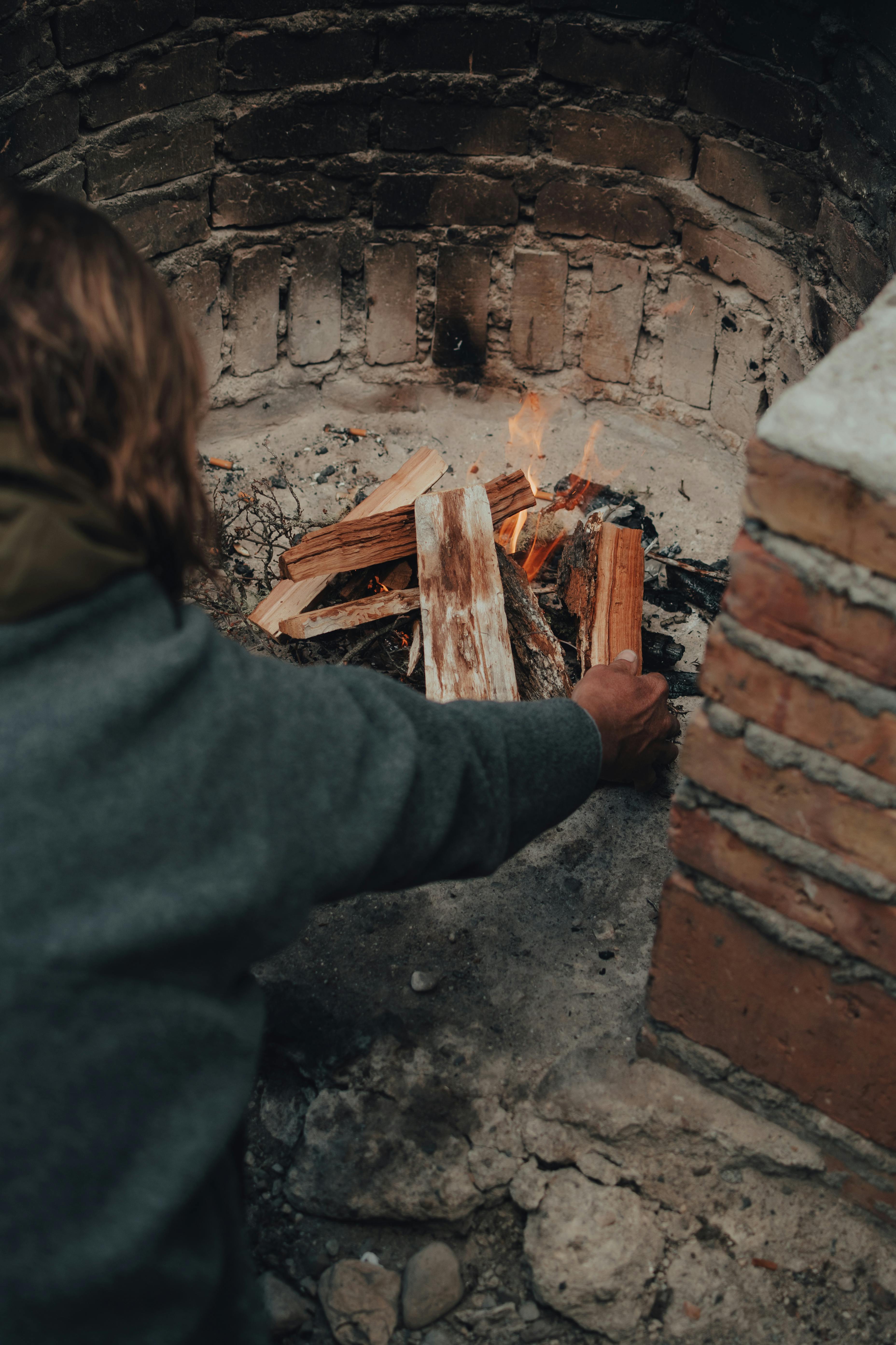 Smoldering wood in hot burning fireplace · Free Stock Photo